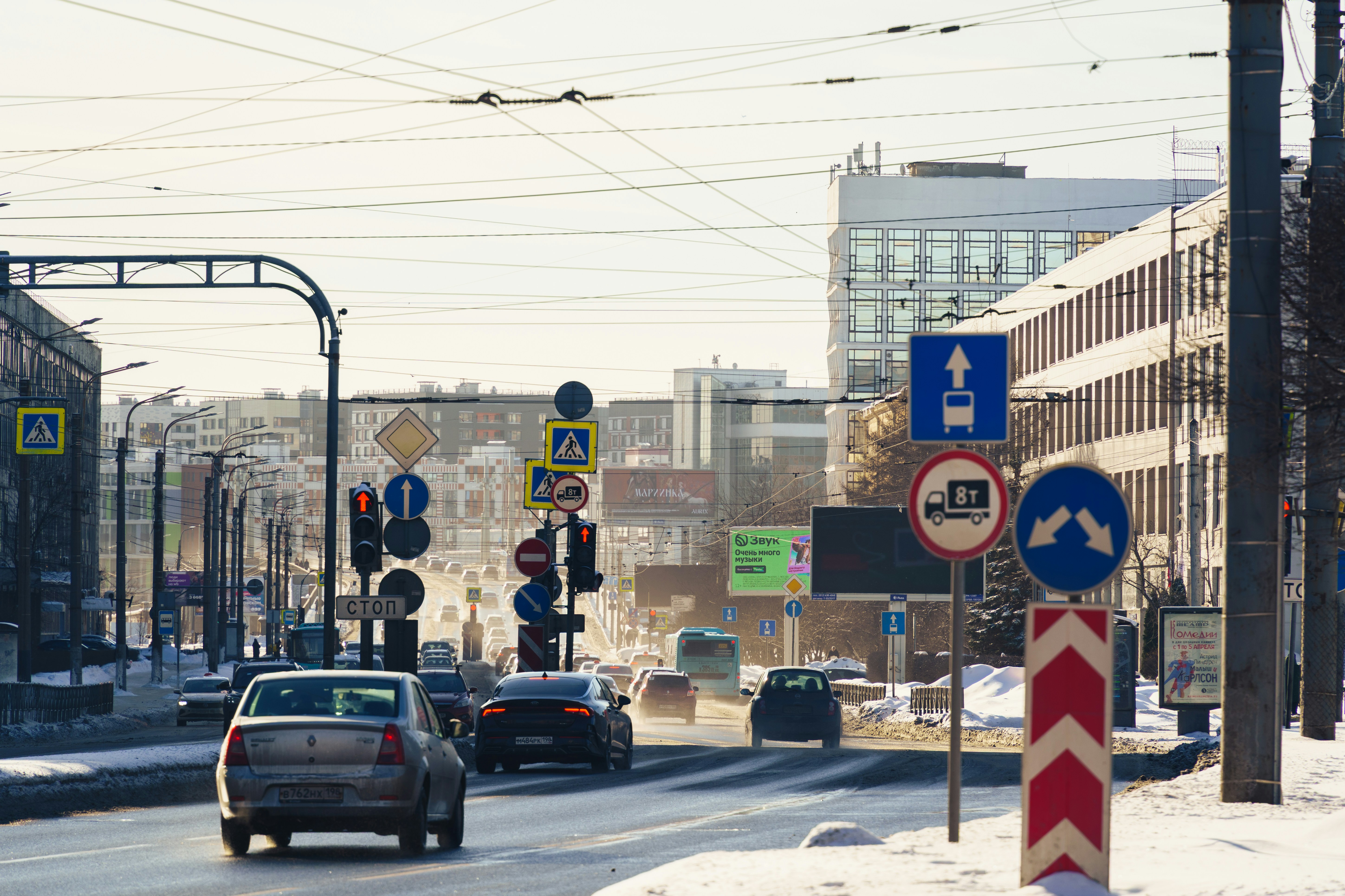 City Street Confluence: Cars, Signals, and Signs in Morning Light