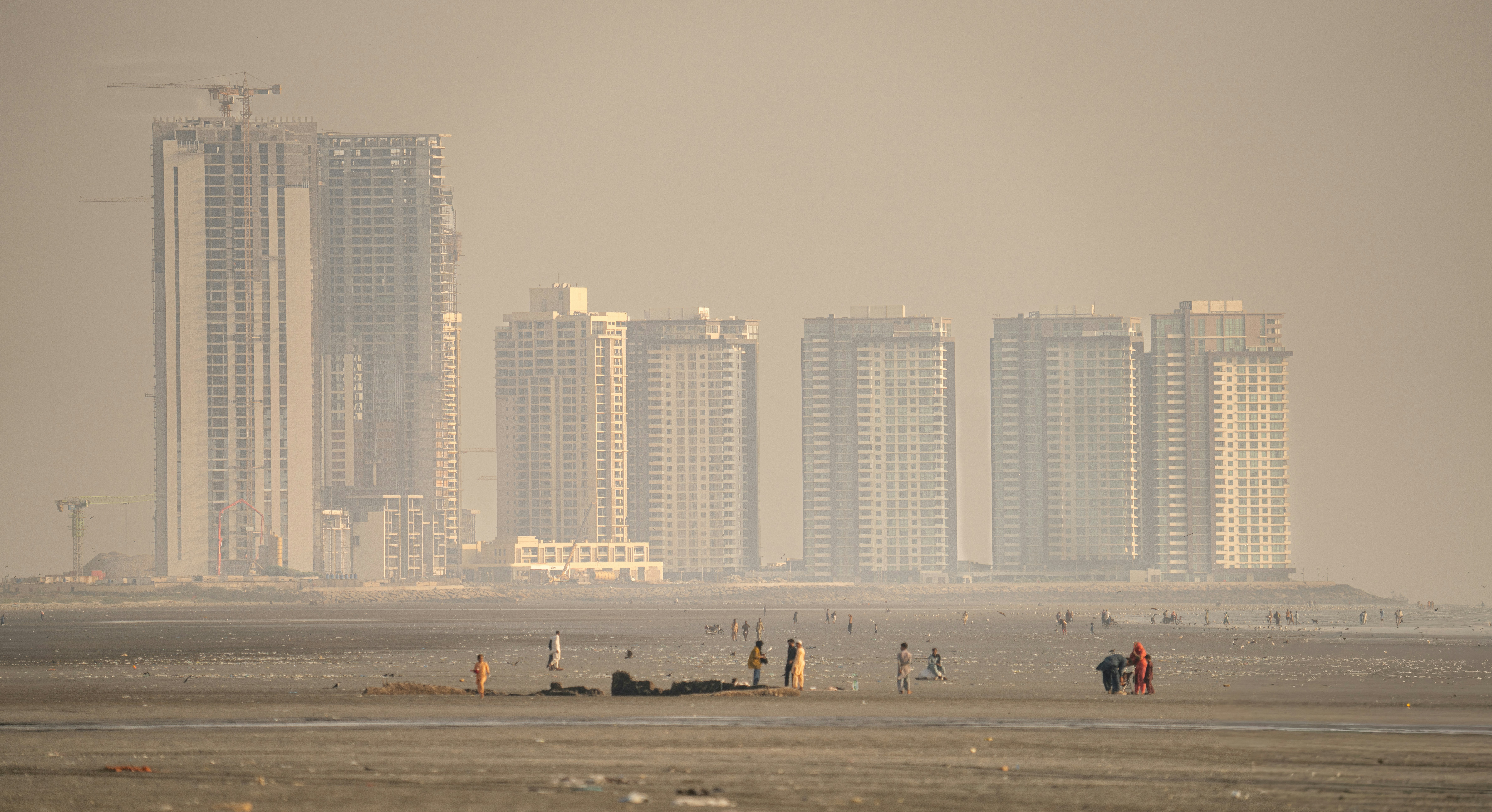 Coastline Metropolis: Towers Rising Over the Quiet Beach