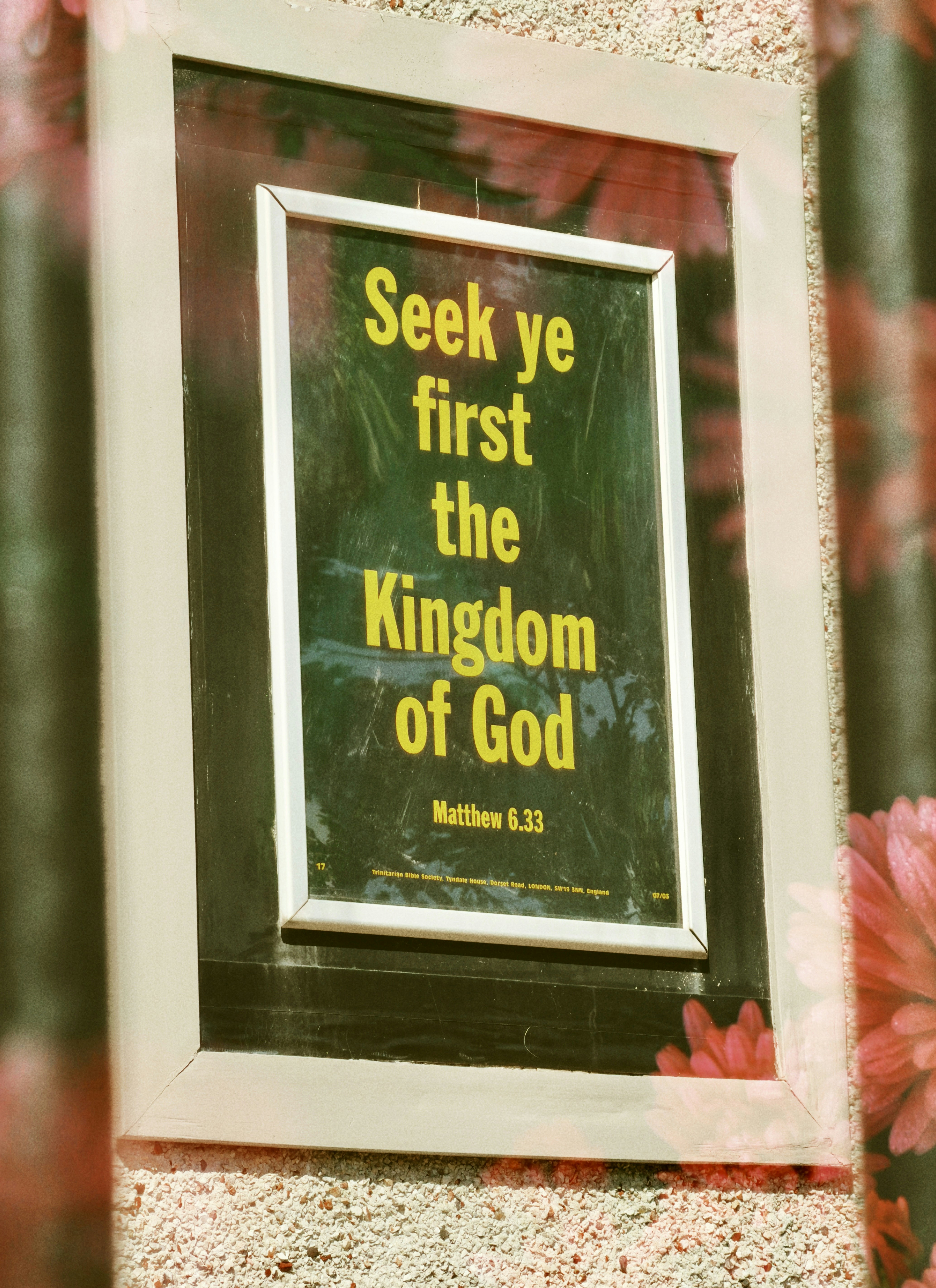Framed sign displaying 'seek ye first the kingdom of god'.
