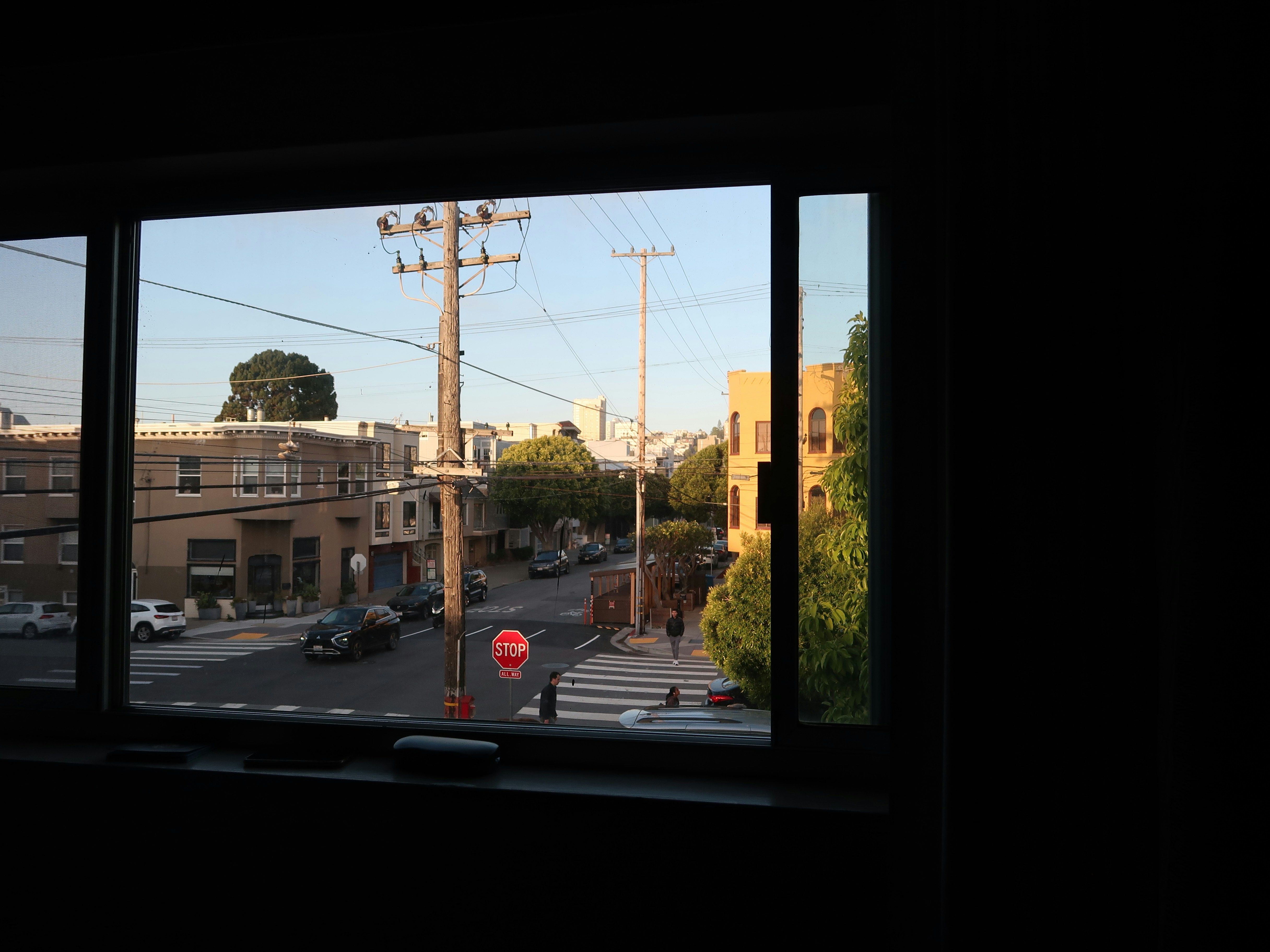 City Street Framed by a Dark Window