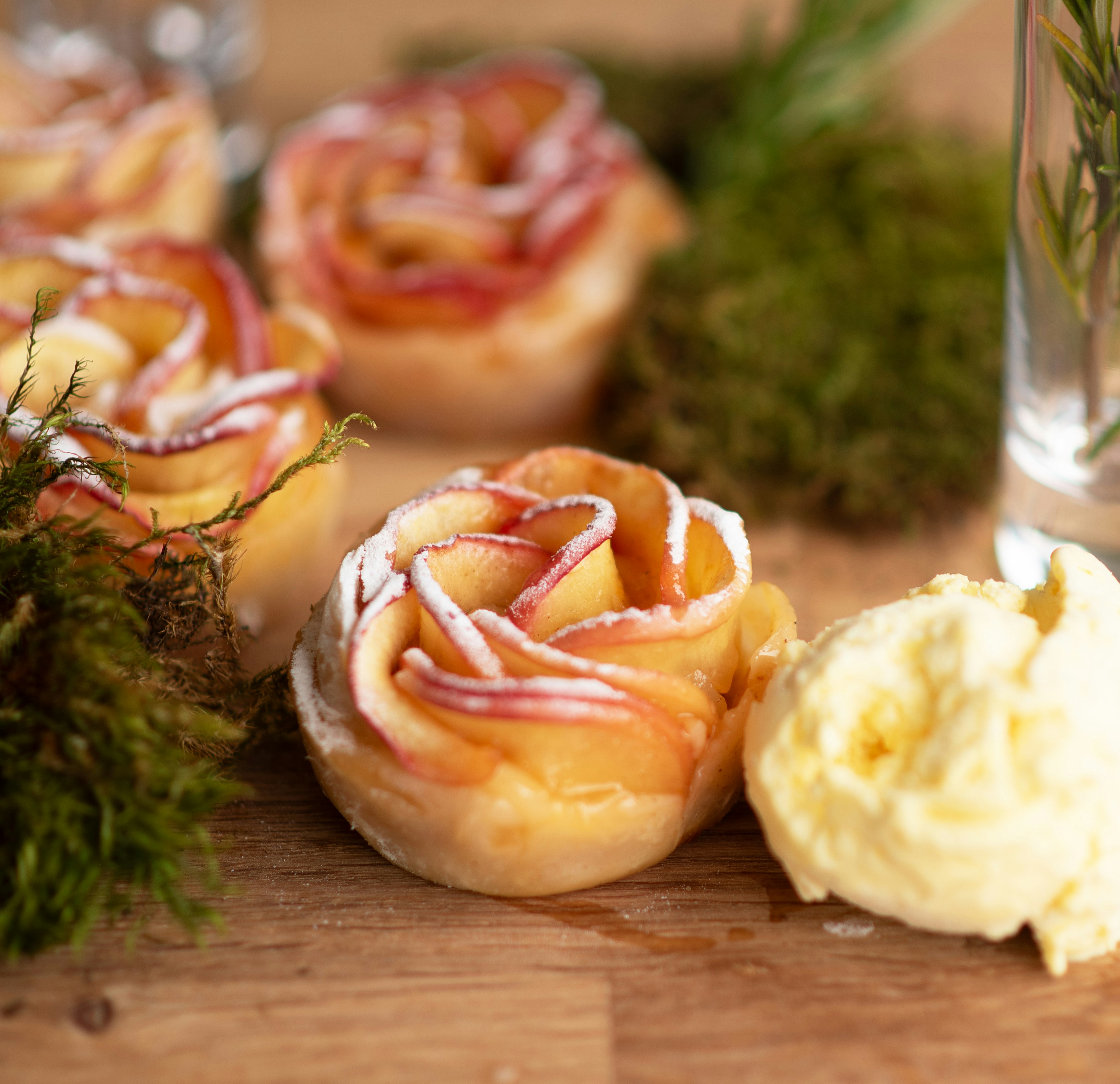 Rose-cream Pastry Garden: Mini Rolls on a Wooden Board