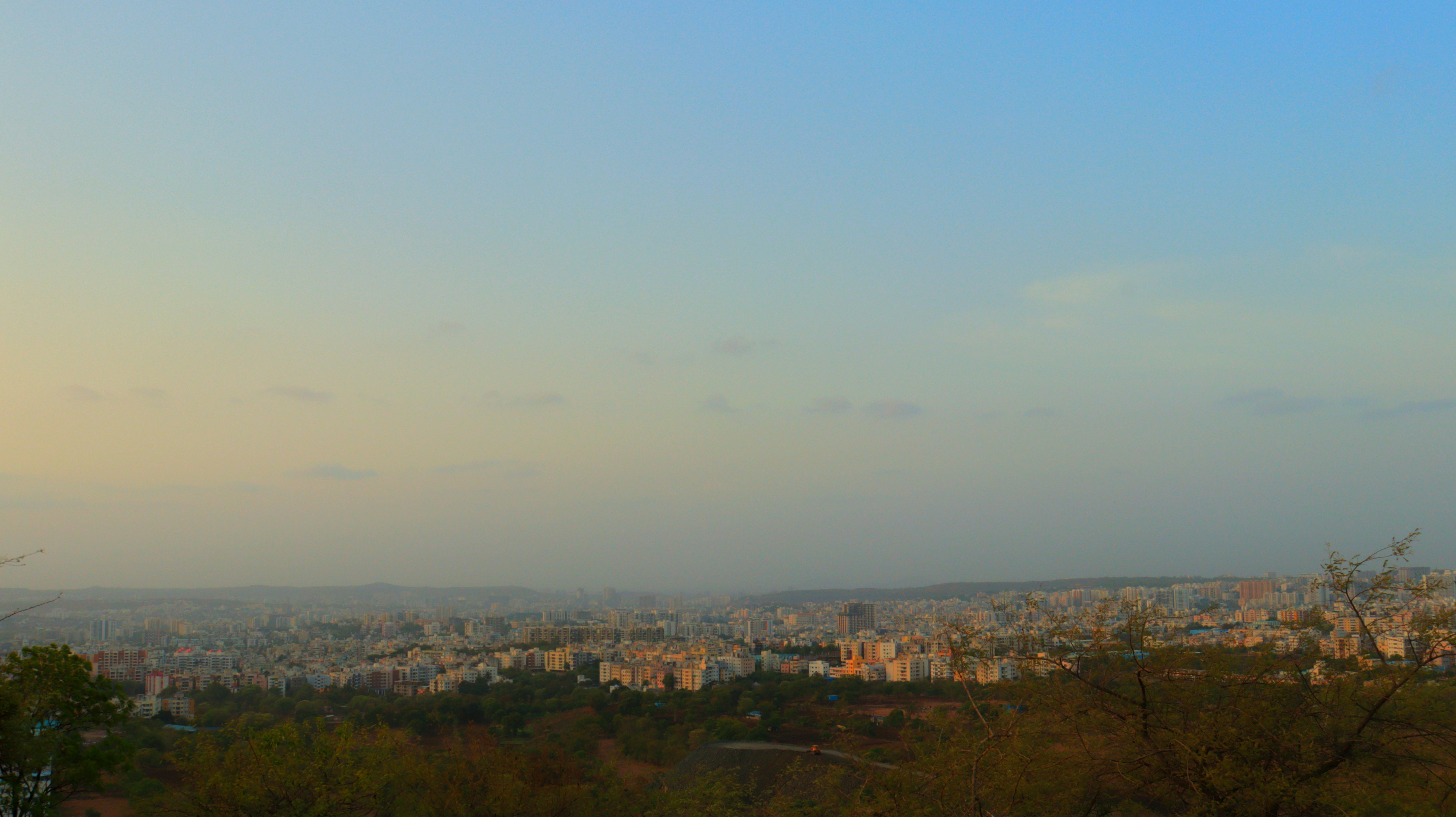 Cityscape on the Horizon: Quiet Hills Meet a Distant Skyline