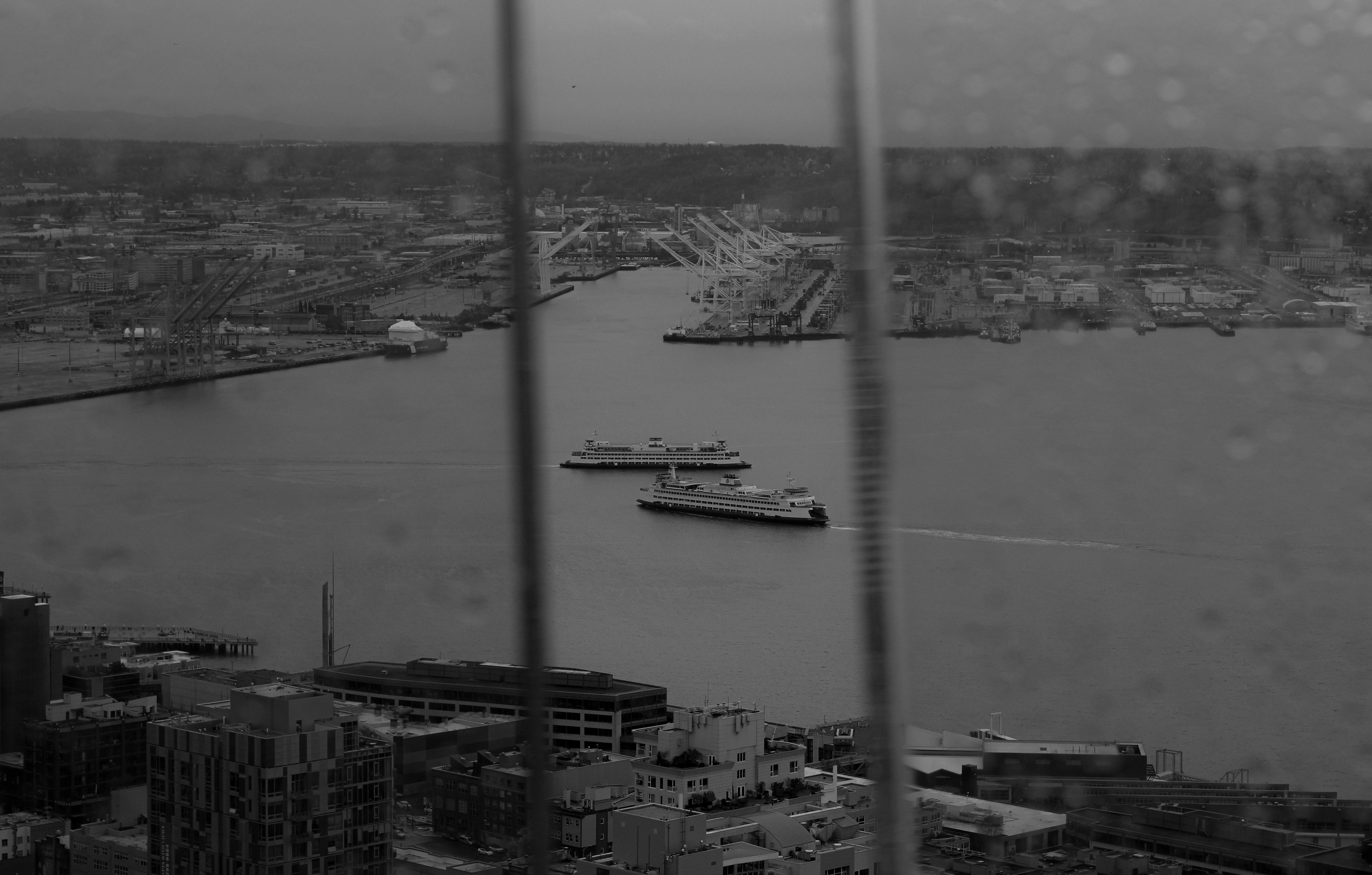 Across the Docks: A Rain-Speckled Cityscape from Above