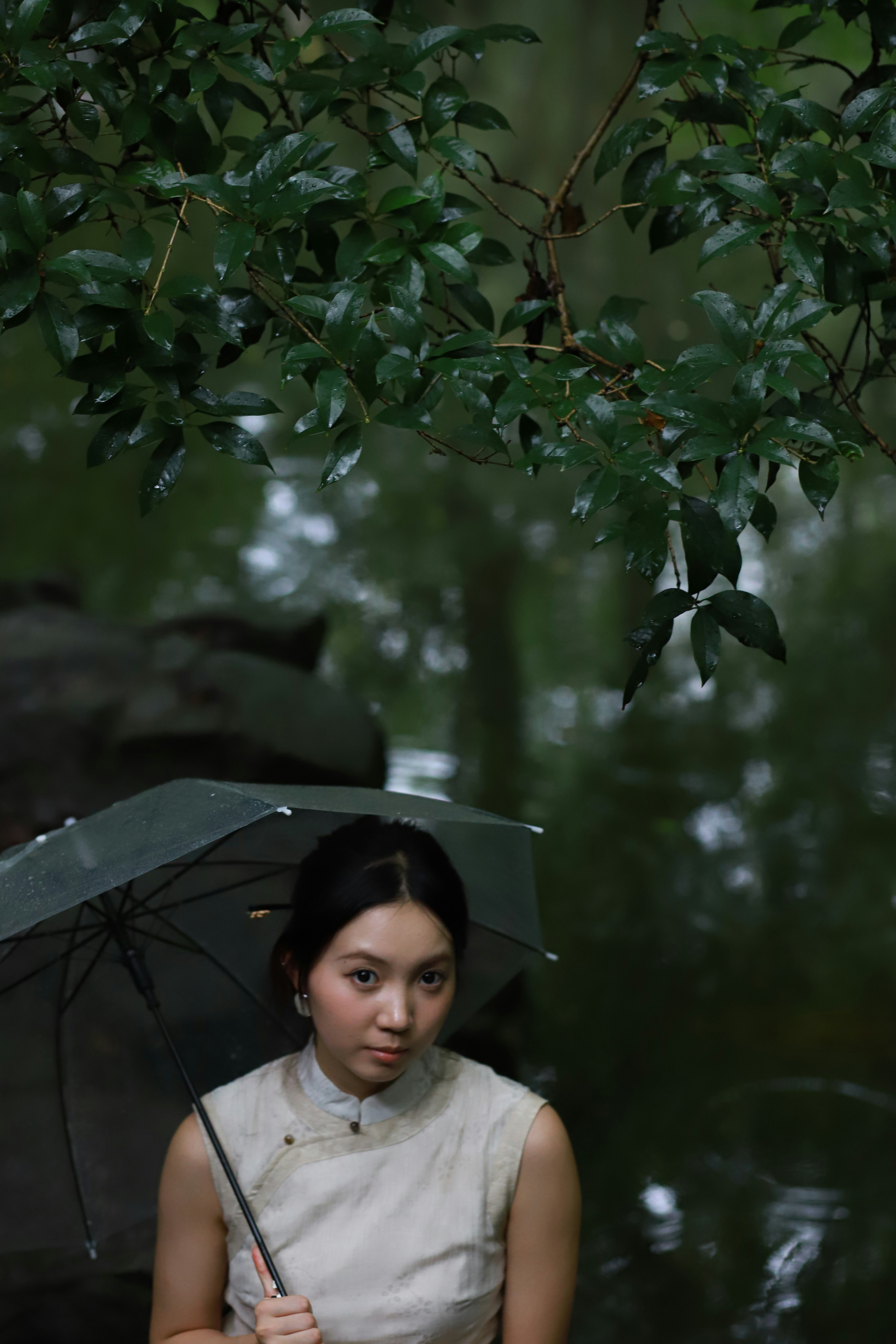 Rainy Night Stillness: Portrait Beneath the Umbrella