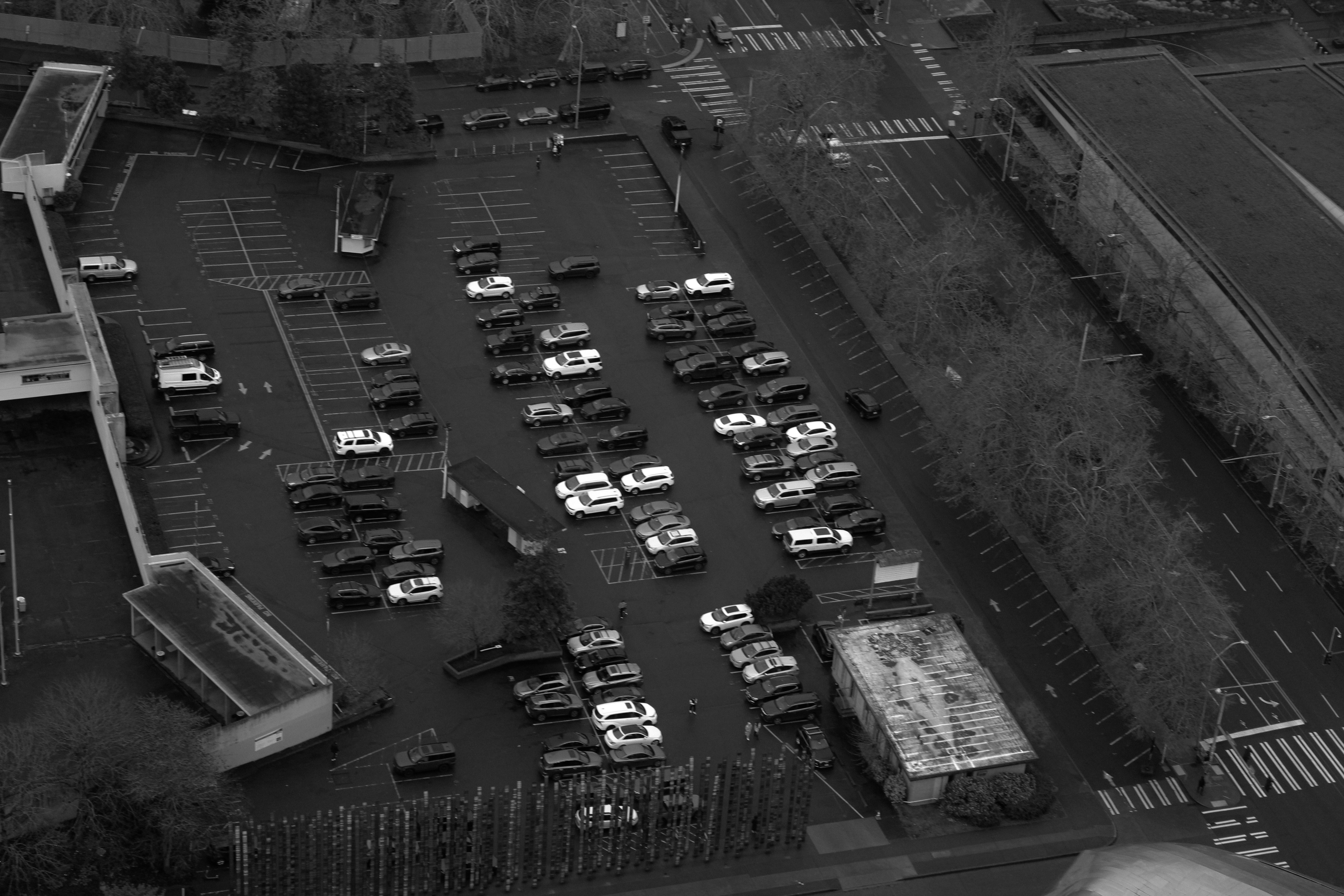 Aerial View of a Municipal Parking Lot Quietly Framed by Urban Geometry