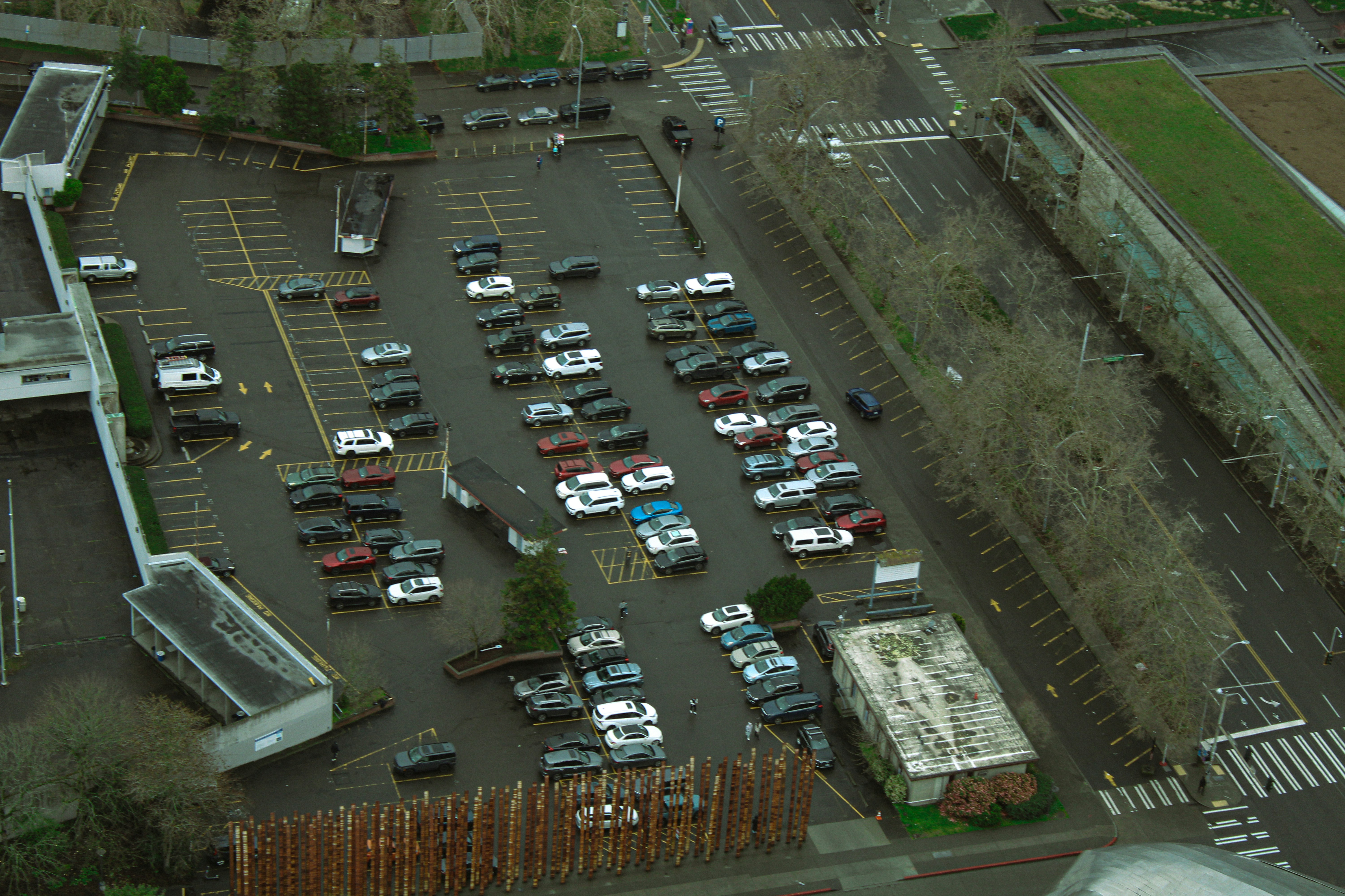 Aerial Grid: Cars Dotted in an Urban Parking Lot