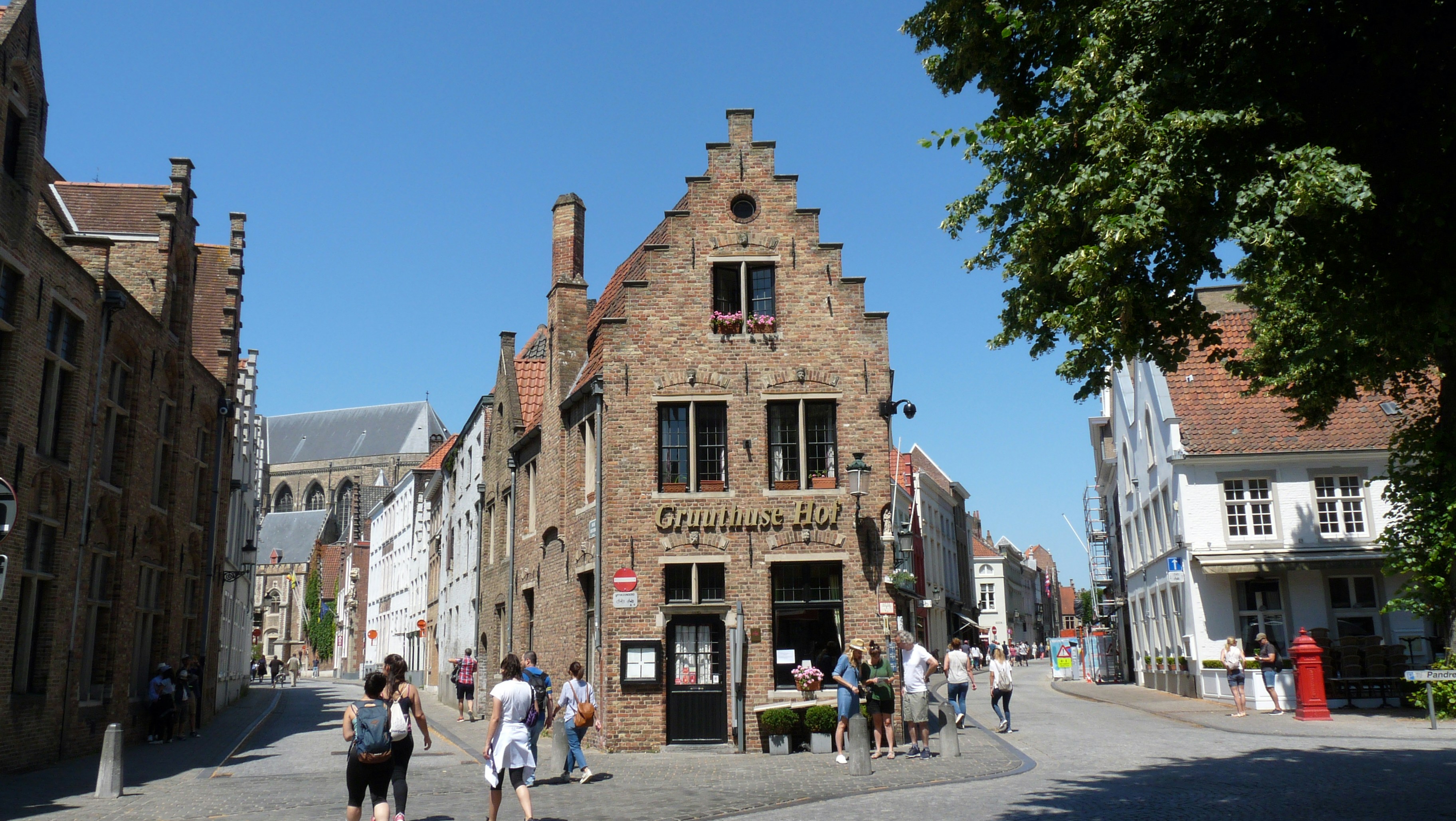 Brick-Gabled Town Hall Silhouette on a Sunlit Flemish Street