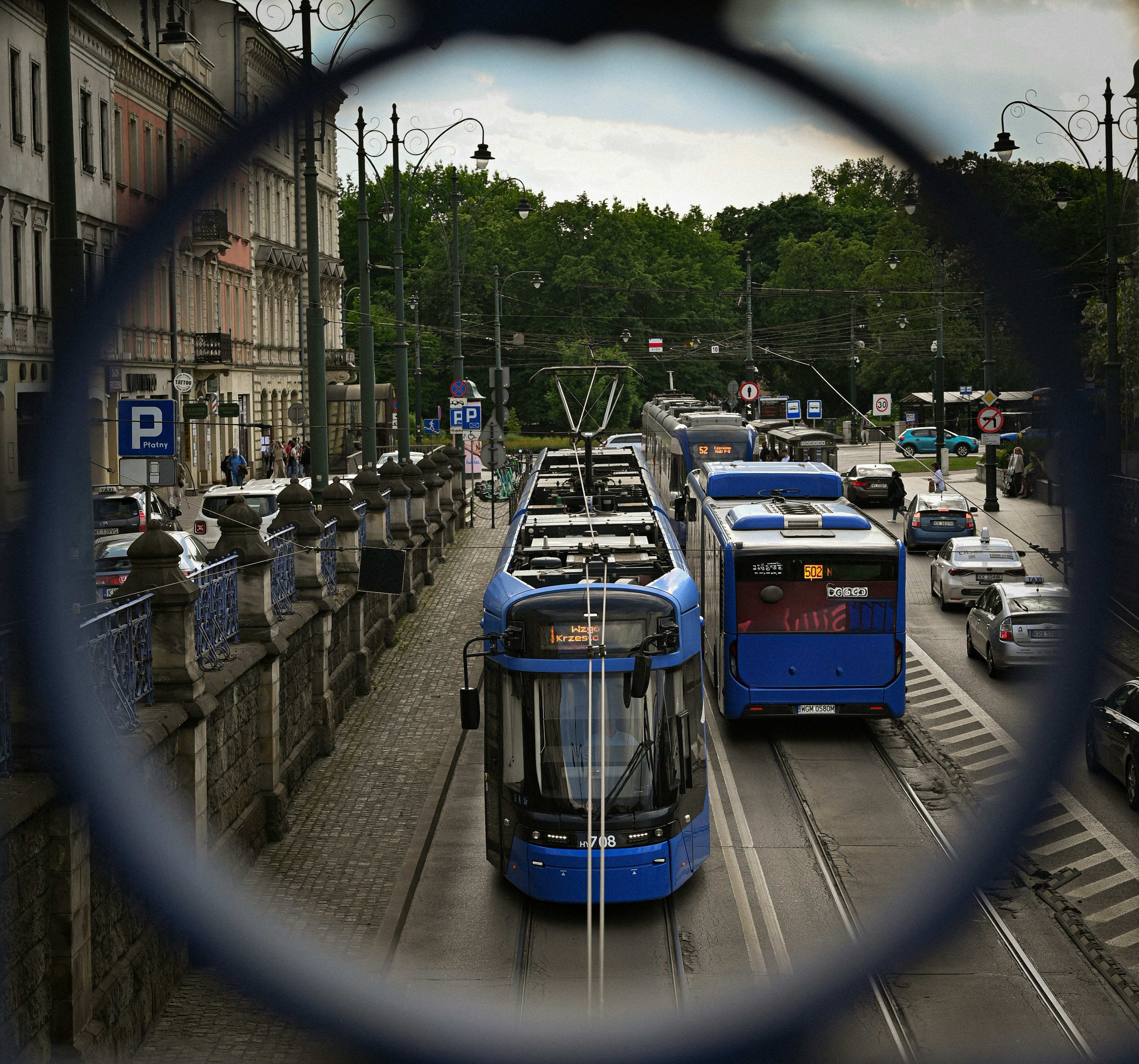 Blue Trains on Rails: A Streetcar Frame through the City