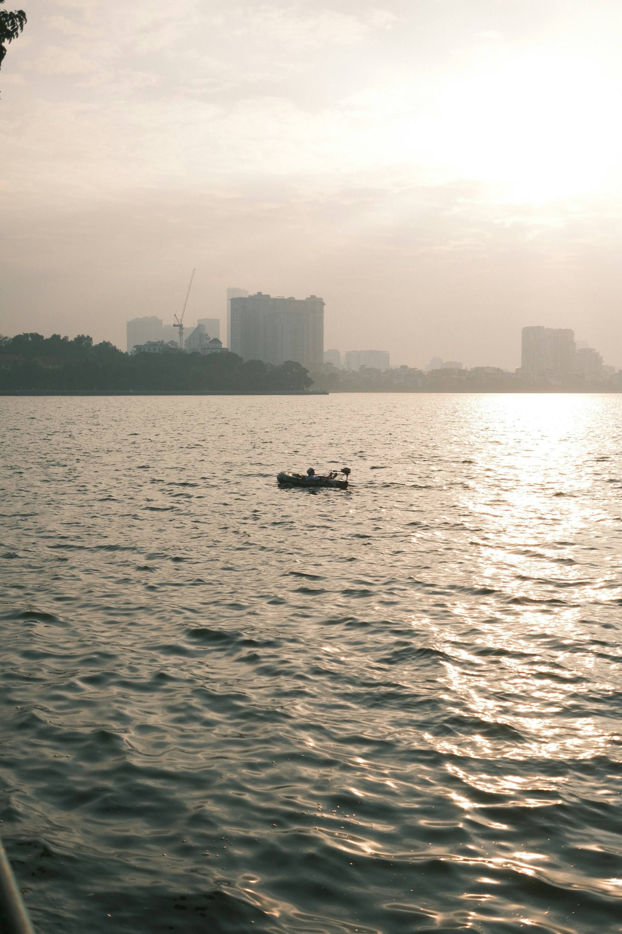 Dawn over the Inlet: Boats Amid a Quiet City Skyline