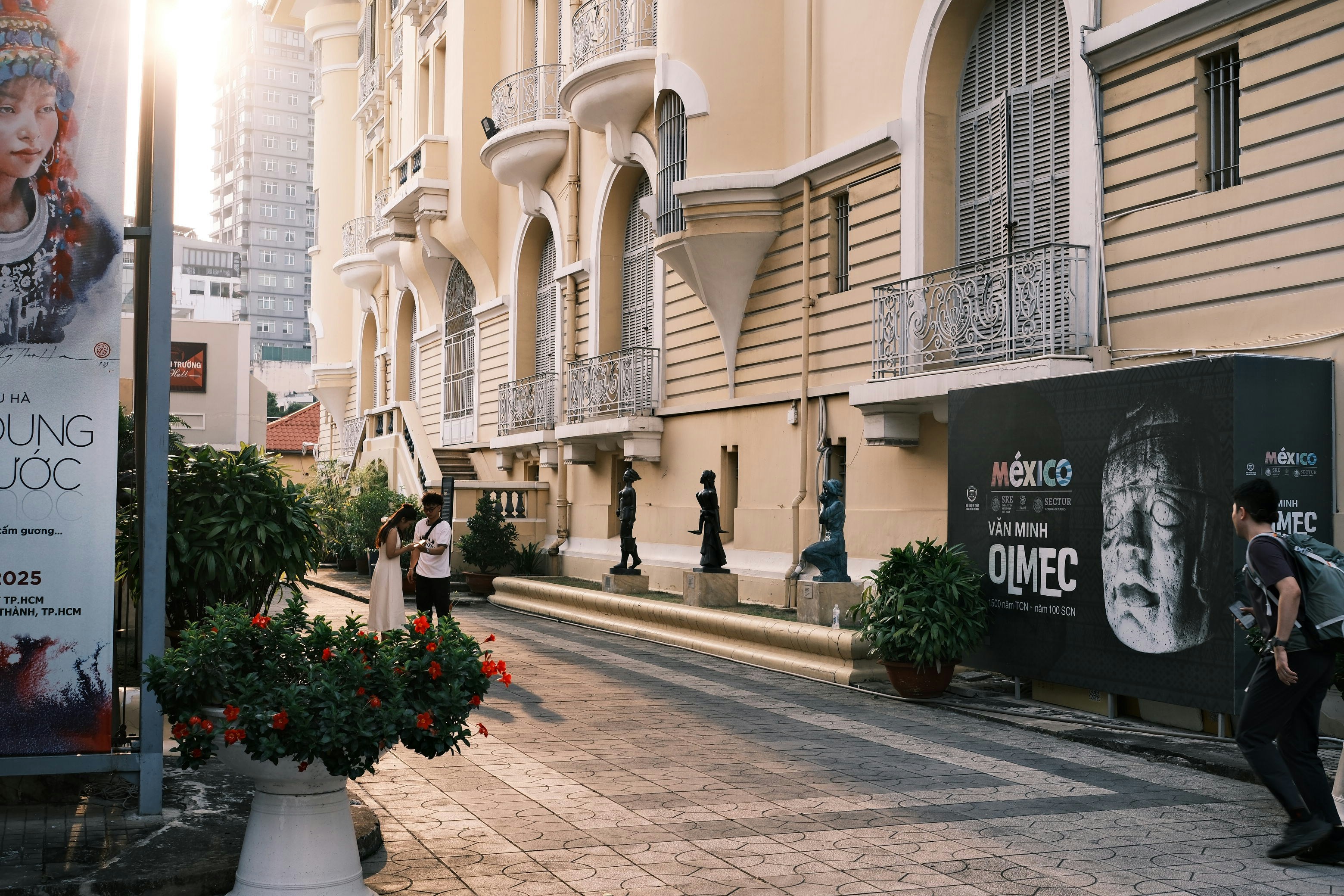 Sunlit Facade: Street Level Calm by Historic Archways