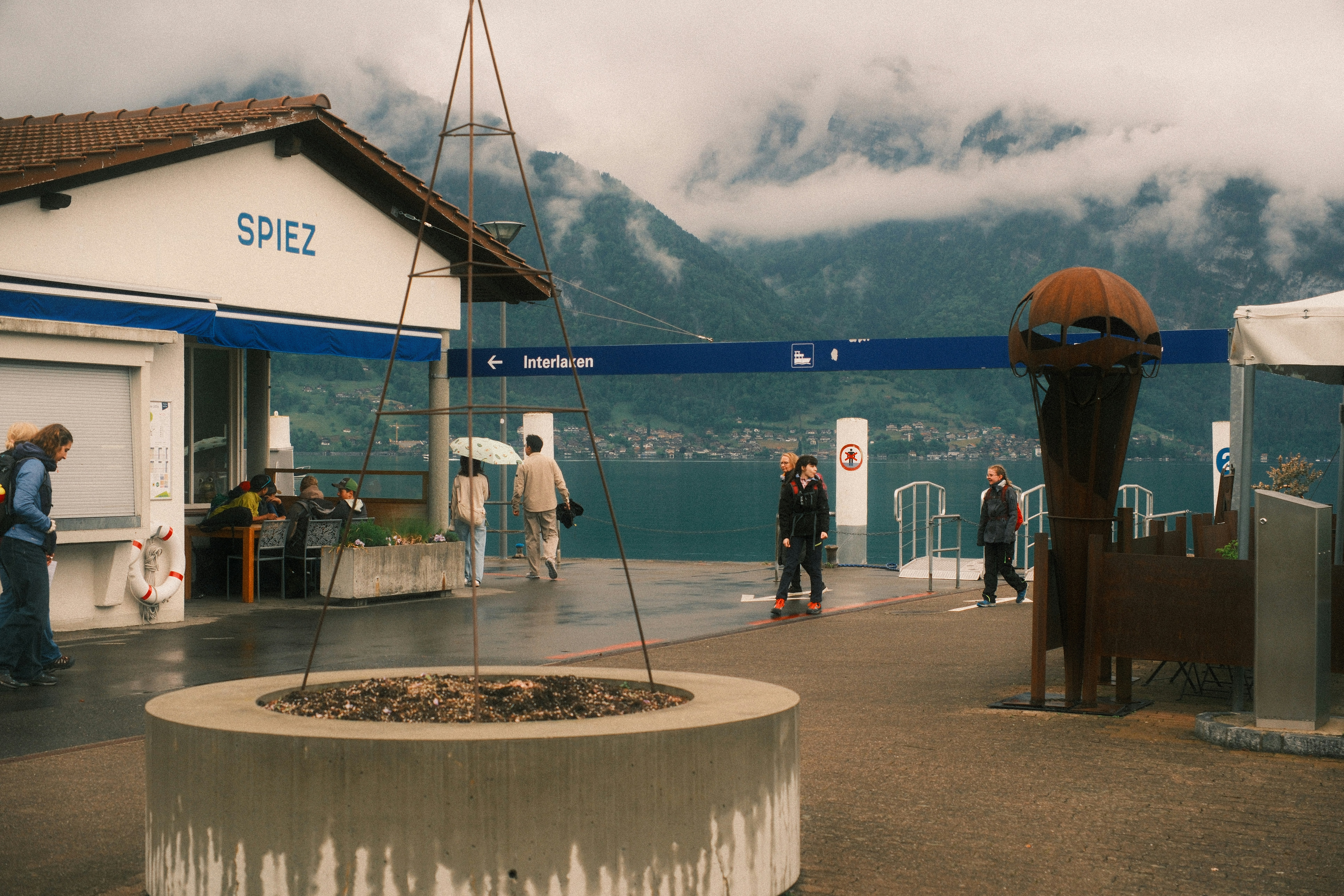 Harbor Front at Spiez: People, Seawall and Mountain Mist