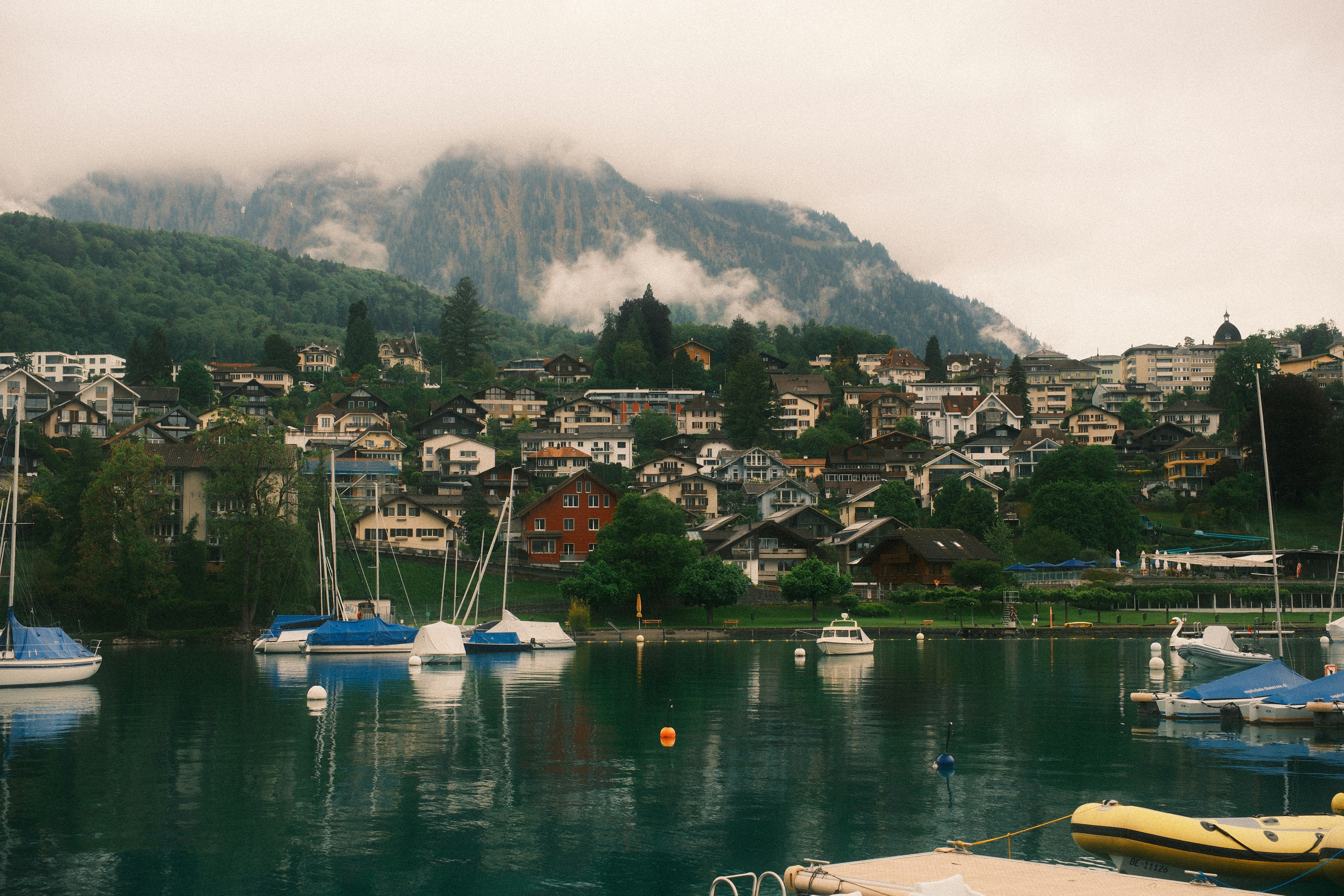Harbor Village at the Foot of Misty Alpine Peaks