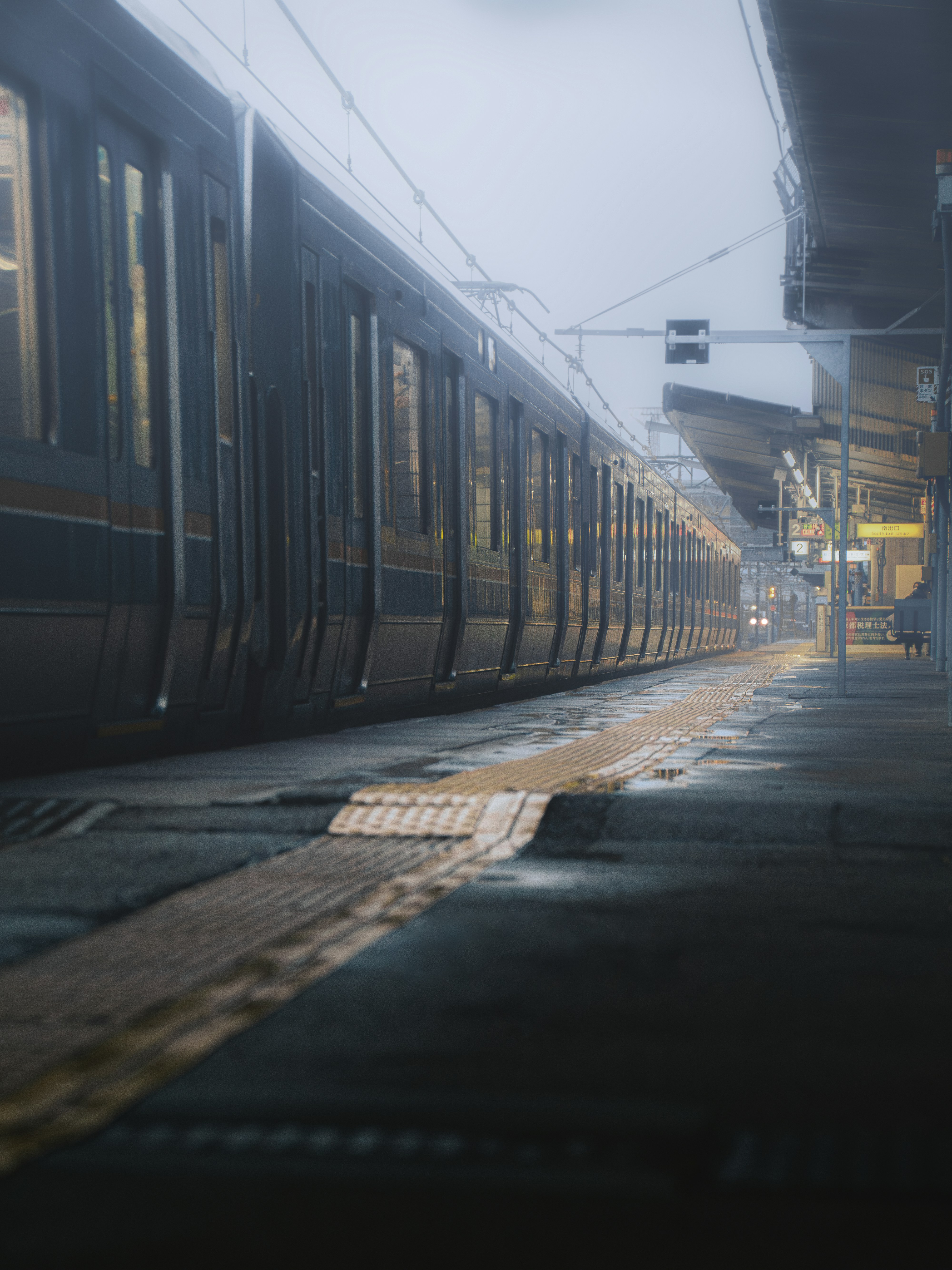 Railway Dawn: A Quiet Conductor’s Perspective Down the Platform