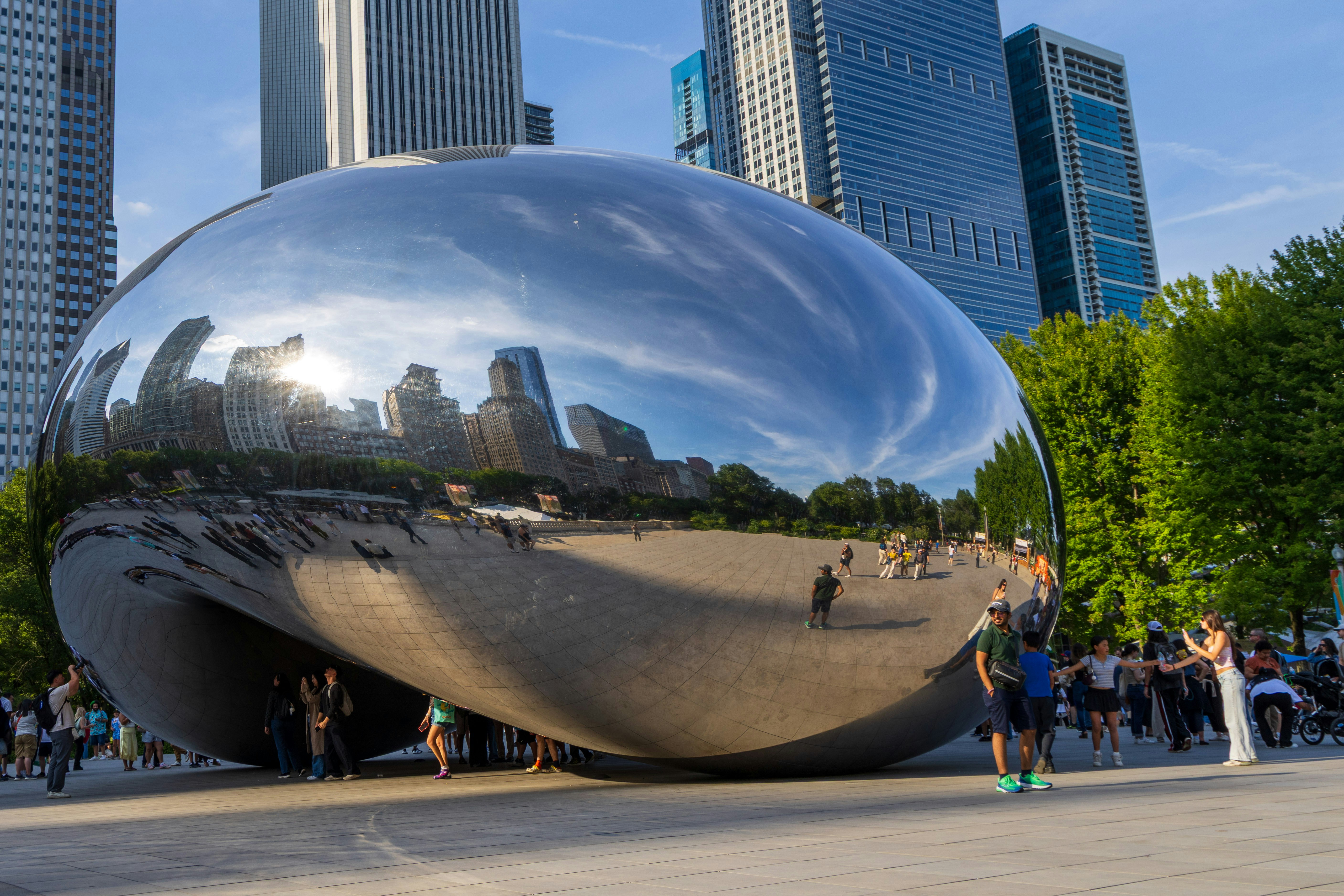 Reflections in Steel: Clouded Sky Meets City Lens