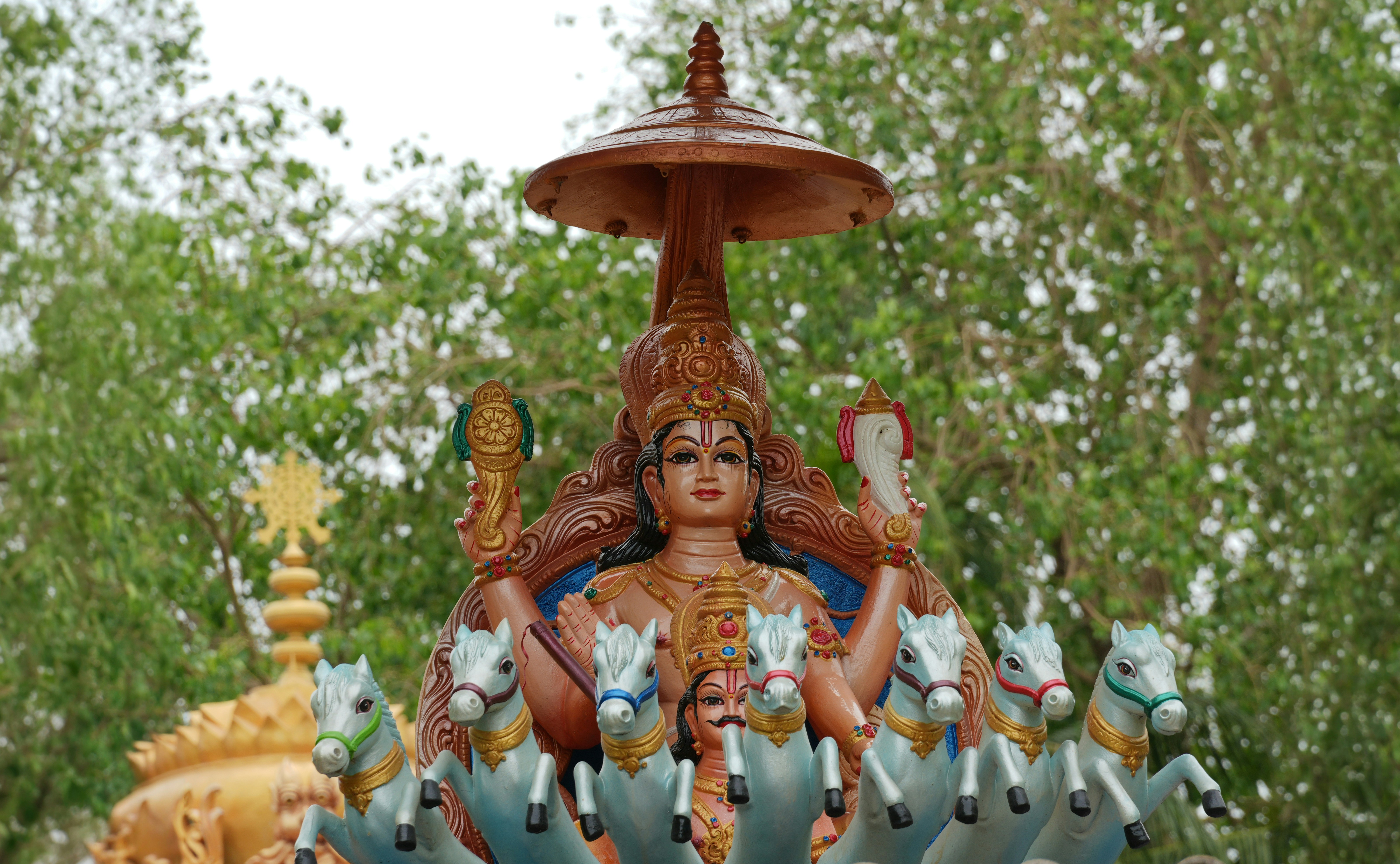 Divine Keeper: Multi-headed Serene Figure Under an Ornate Roof