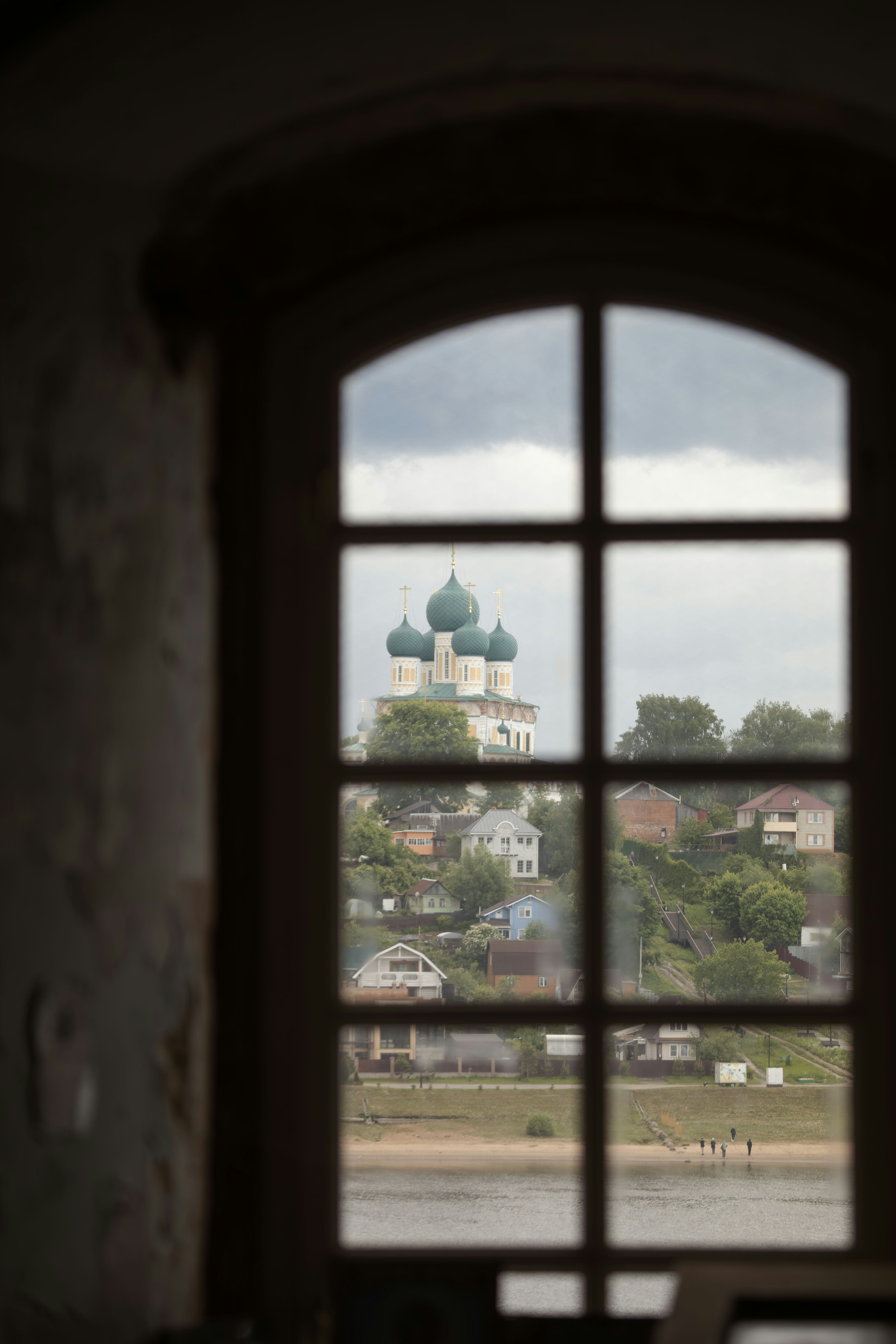 Church of Turquoise Domes Seen Through a Window Grid