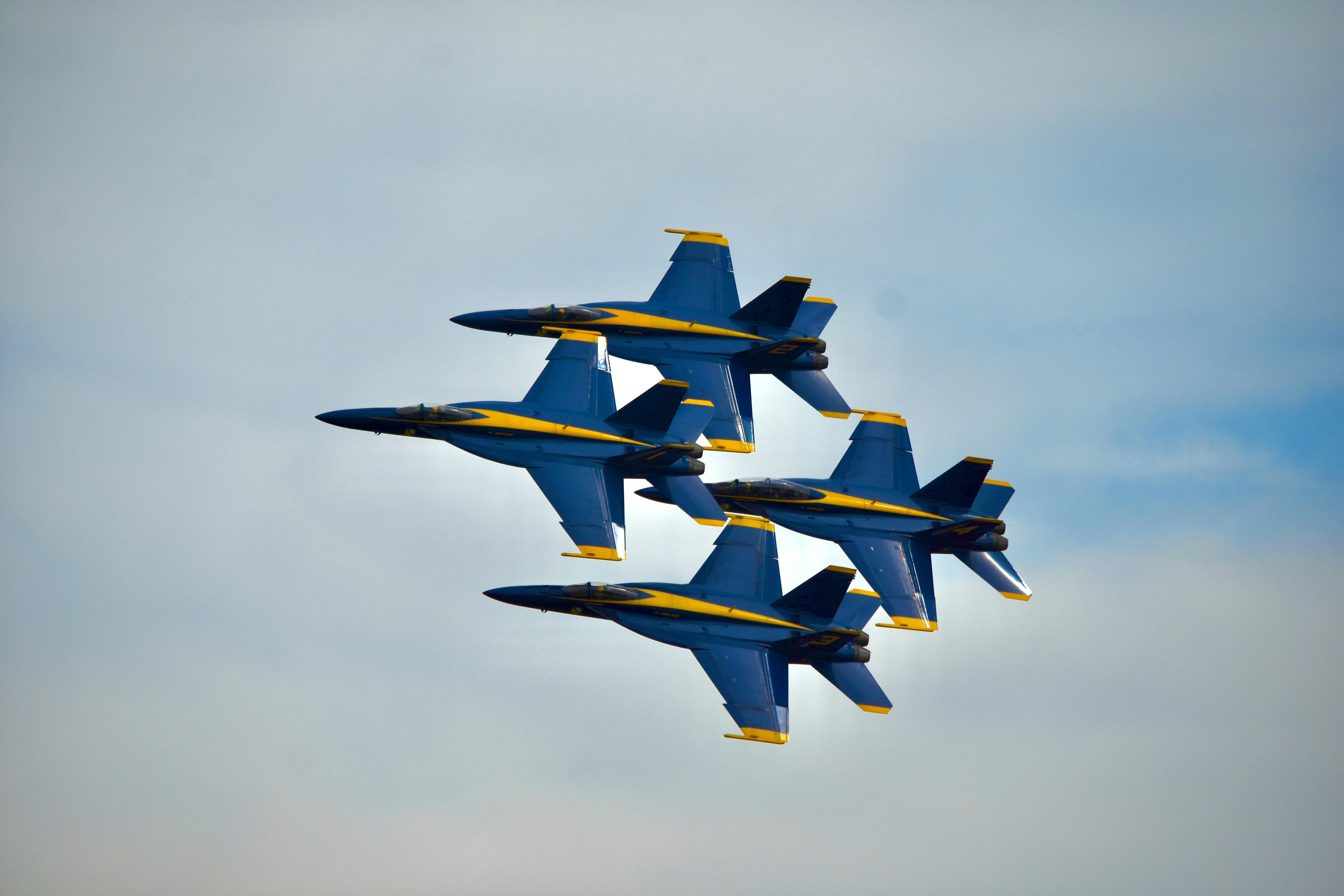 Formation in Sky: Four Blue Falcons in Tight Diamond