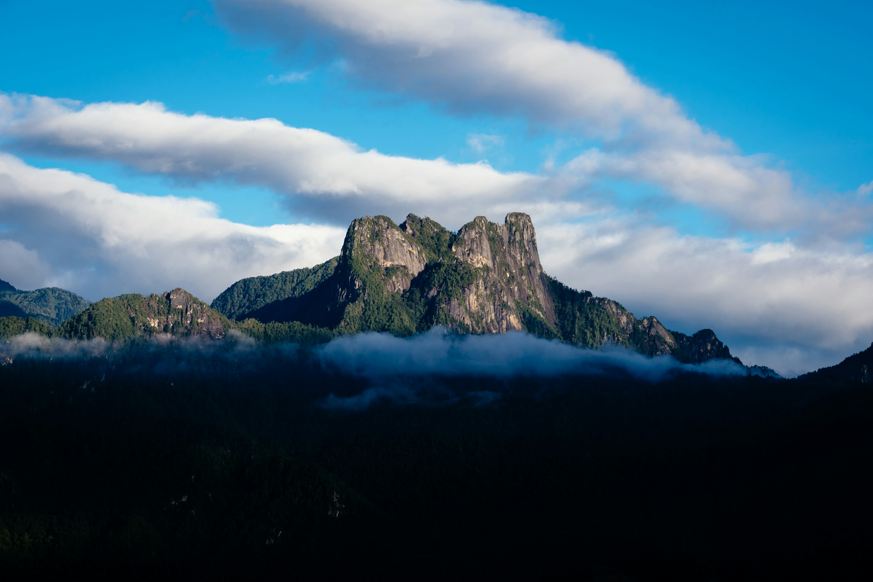 Ridge of Quiet Peaks Under a Cascading Sky