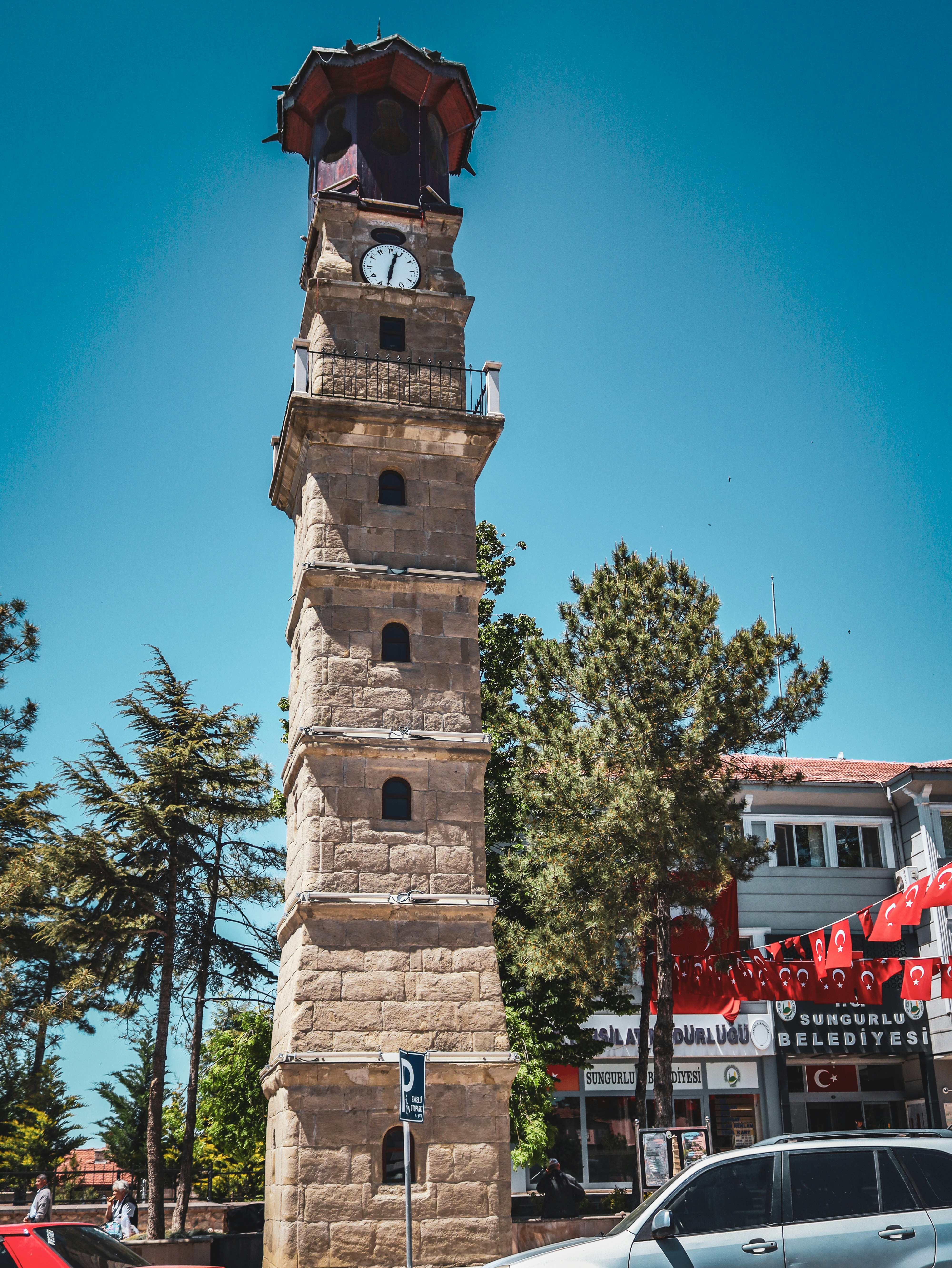 Stone Clocktower Reaching Toward a Clear Sky