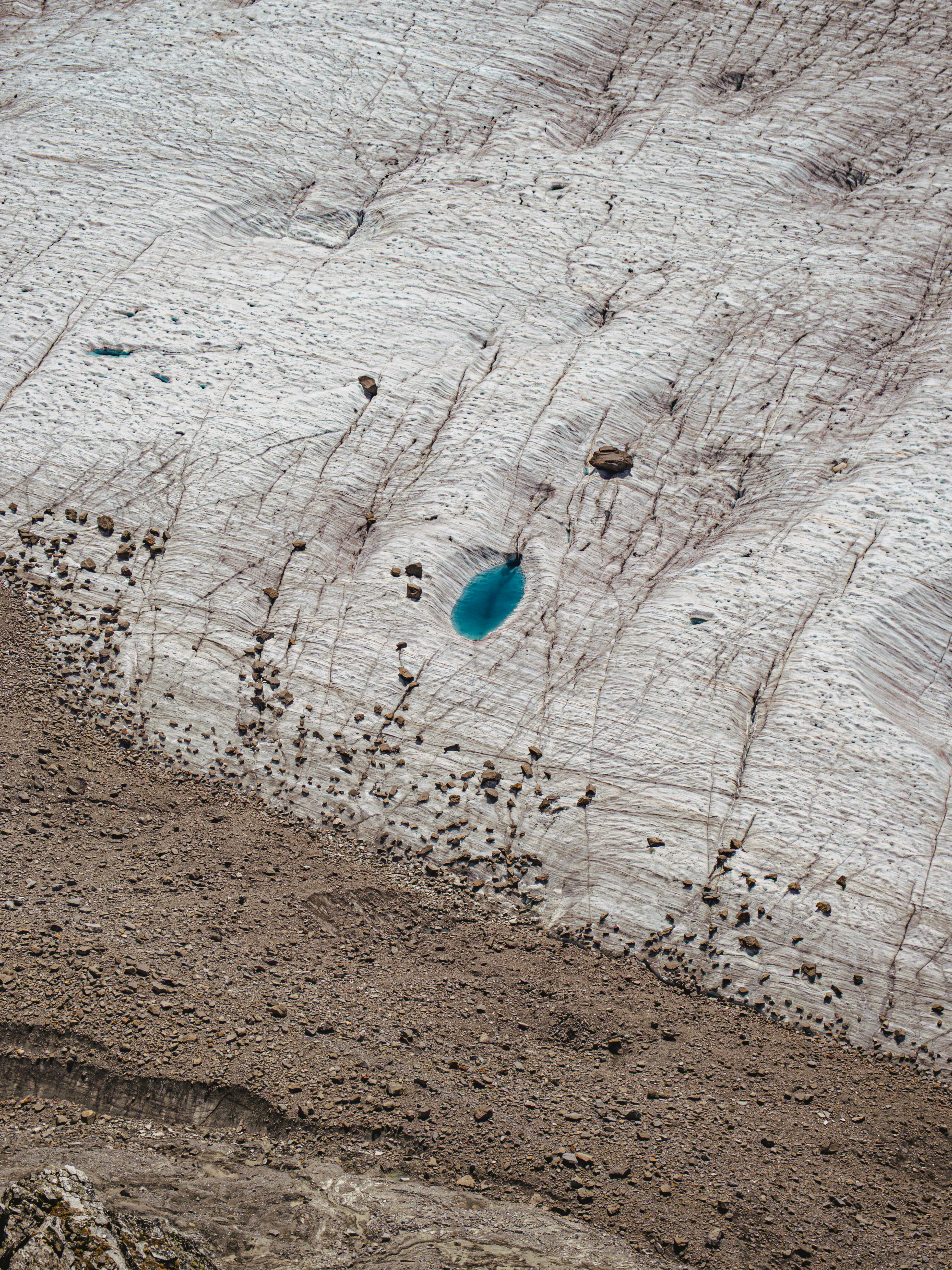 Teal Tear in Painted Wall: A Close Encounter with Color