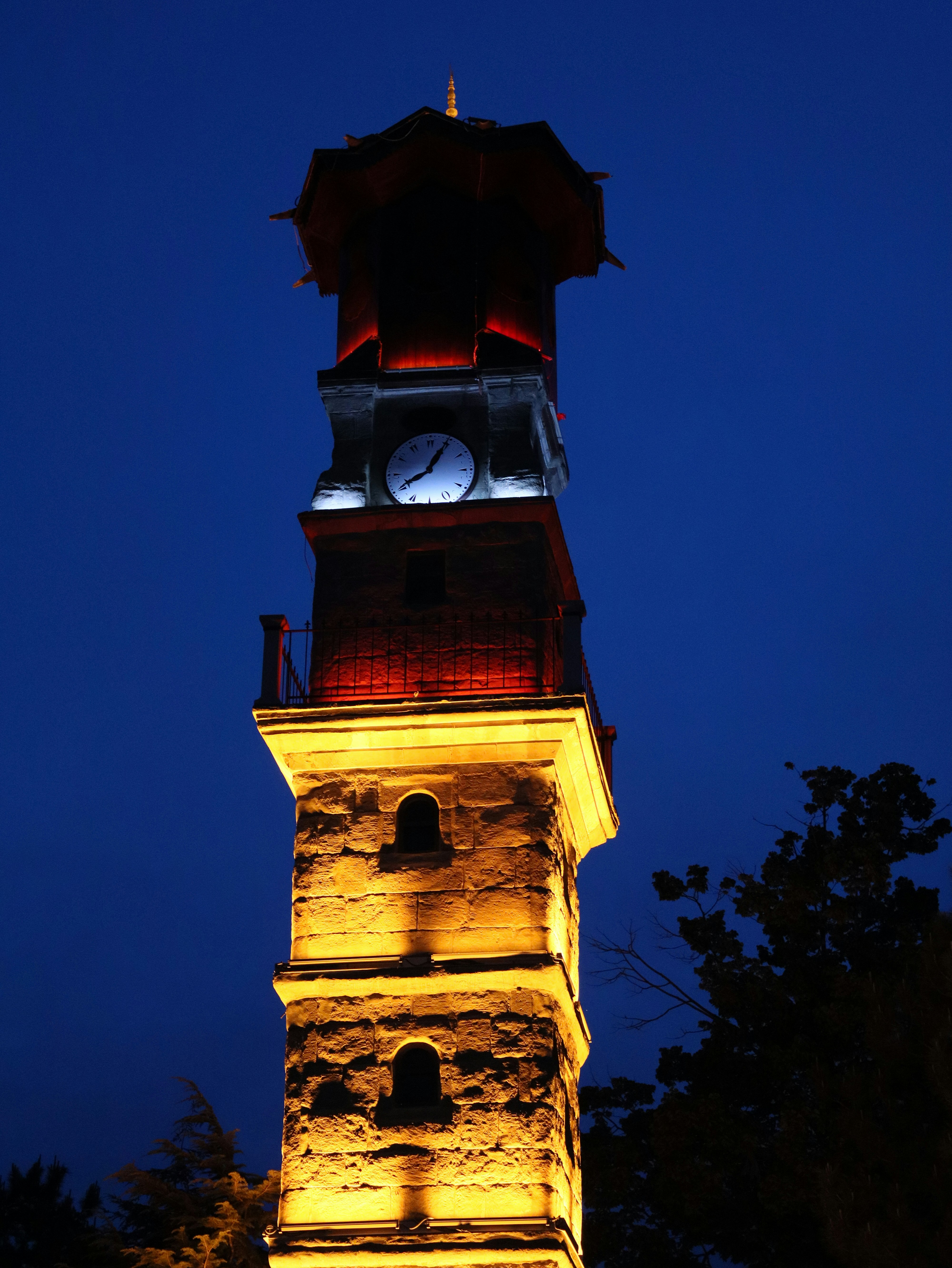 Moonlit Tower: An Evening Clock Over a Granite Spire