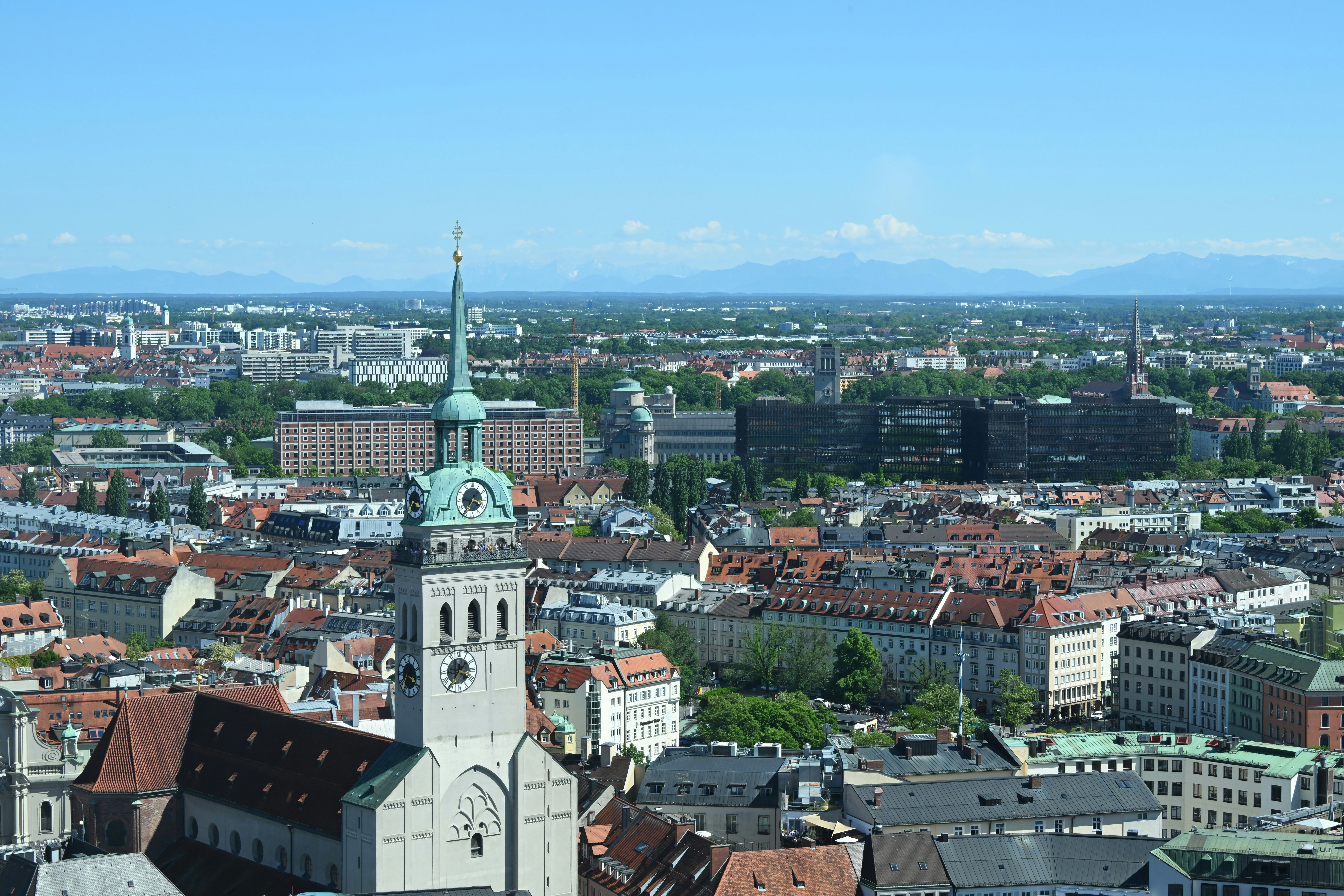 City Clocktower Rising Above a Sea of Red Tile Roofs