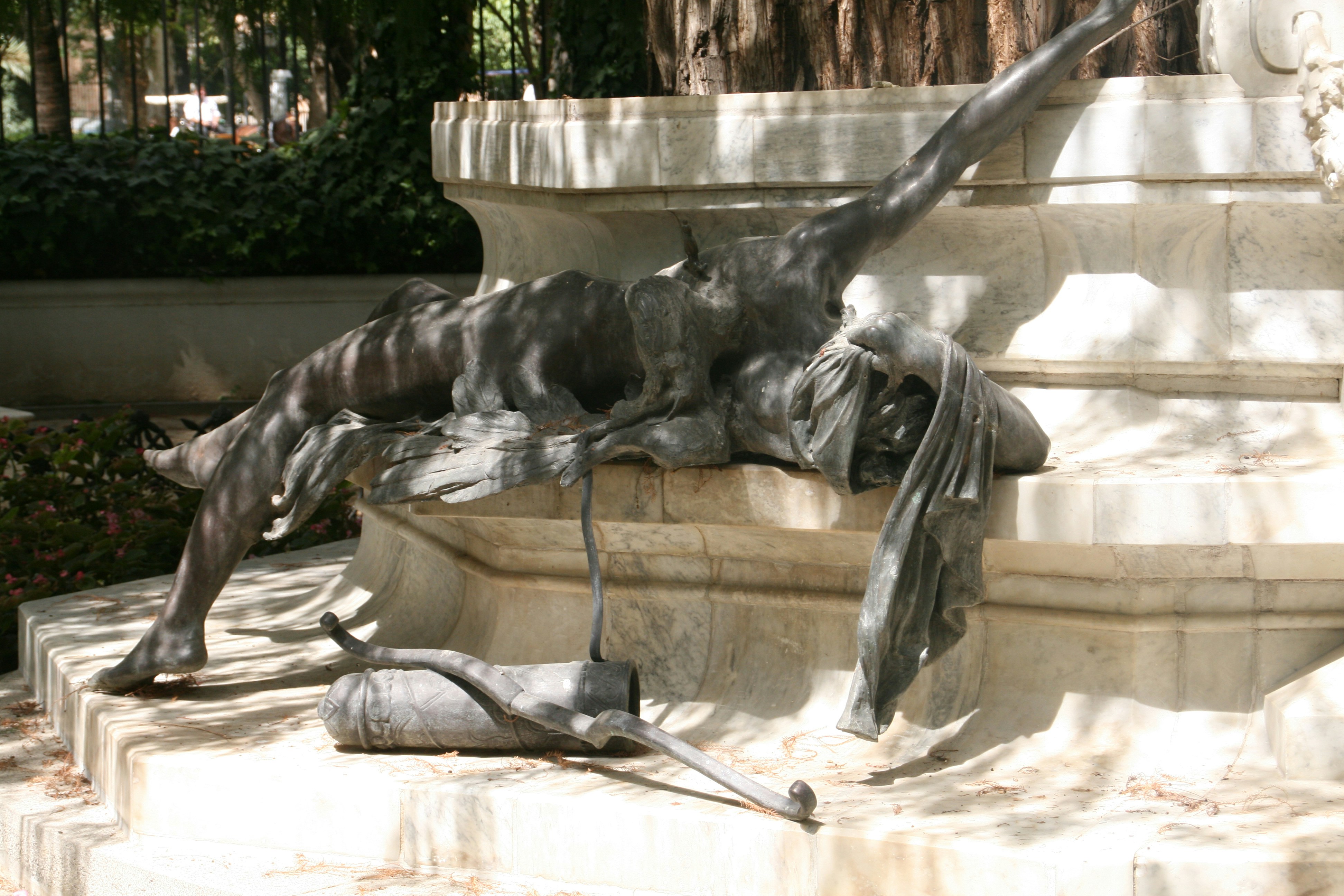 Resting Winged Warrior: A Bronze Gesture by the Fountain