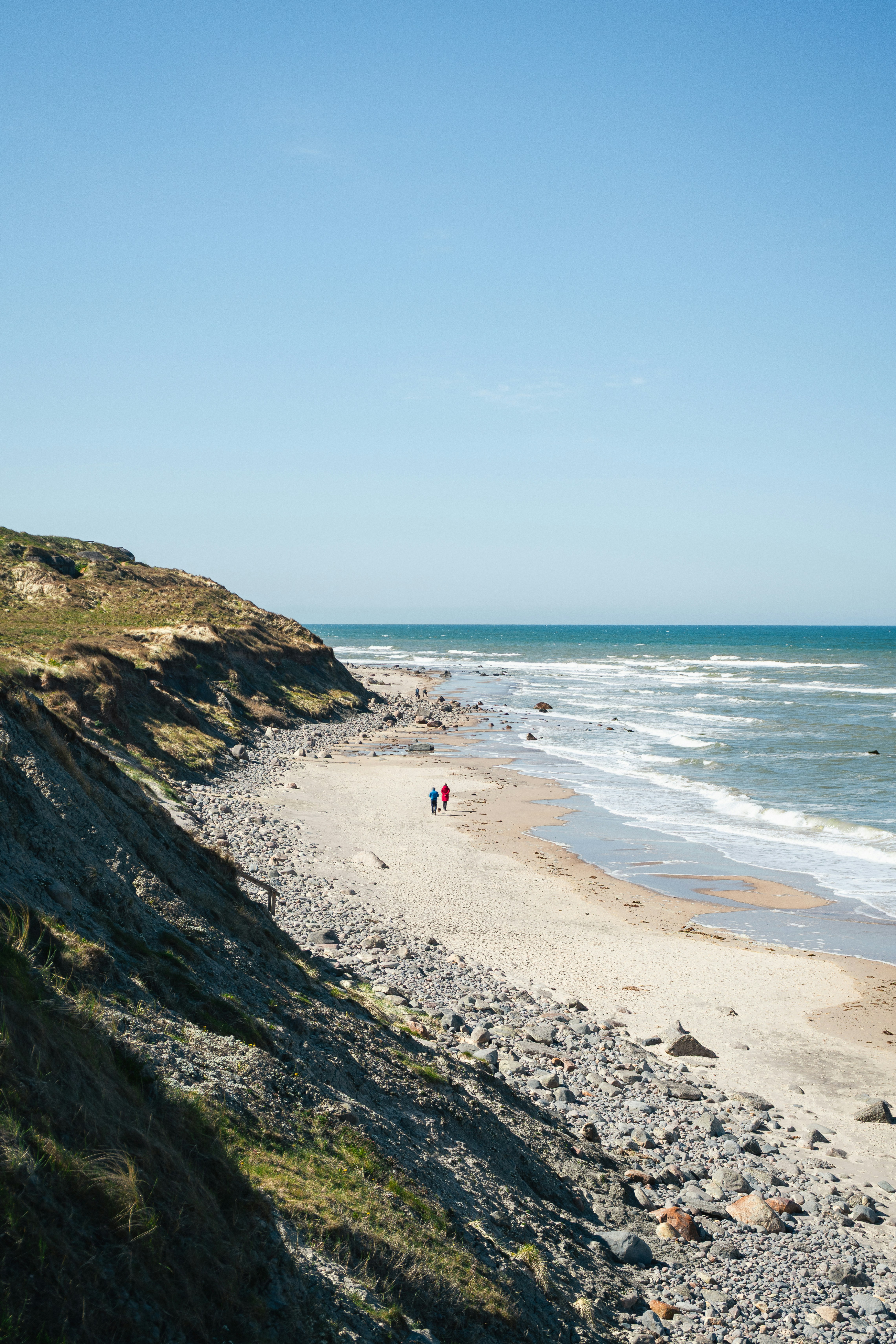 Coastal Cliffs Meet a Quiet Beach Stroll