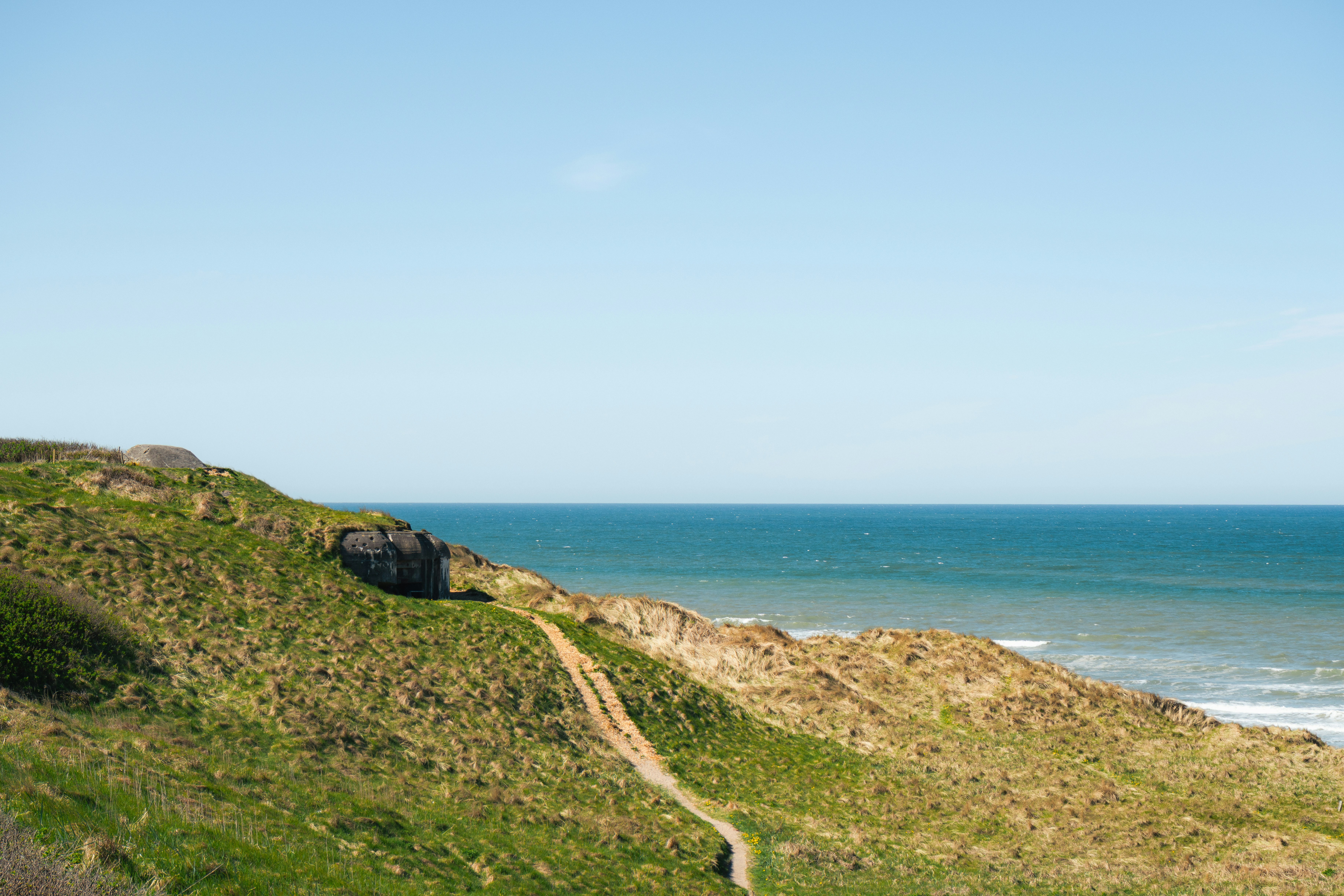 Coastal Path winding toward the blue horizon