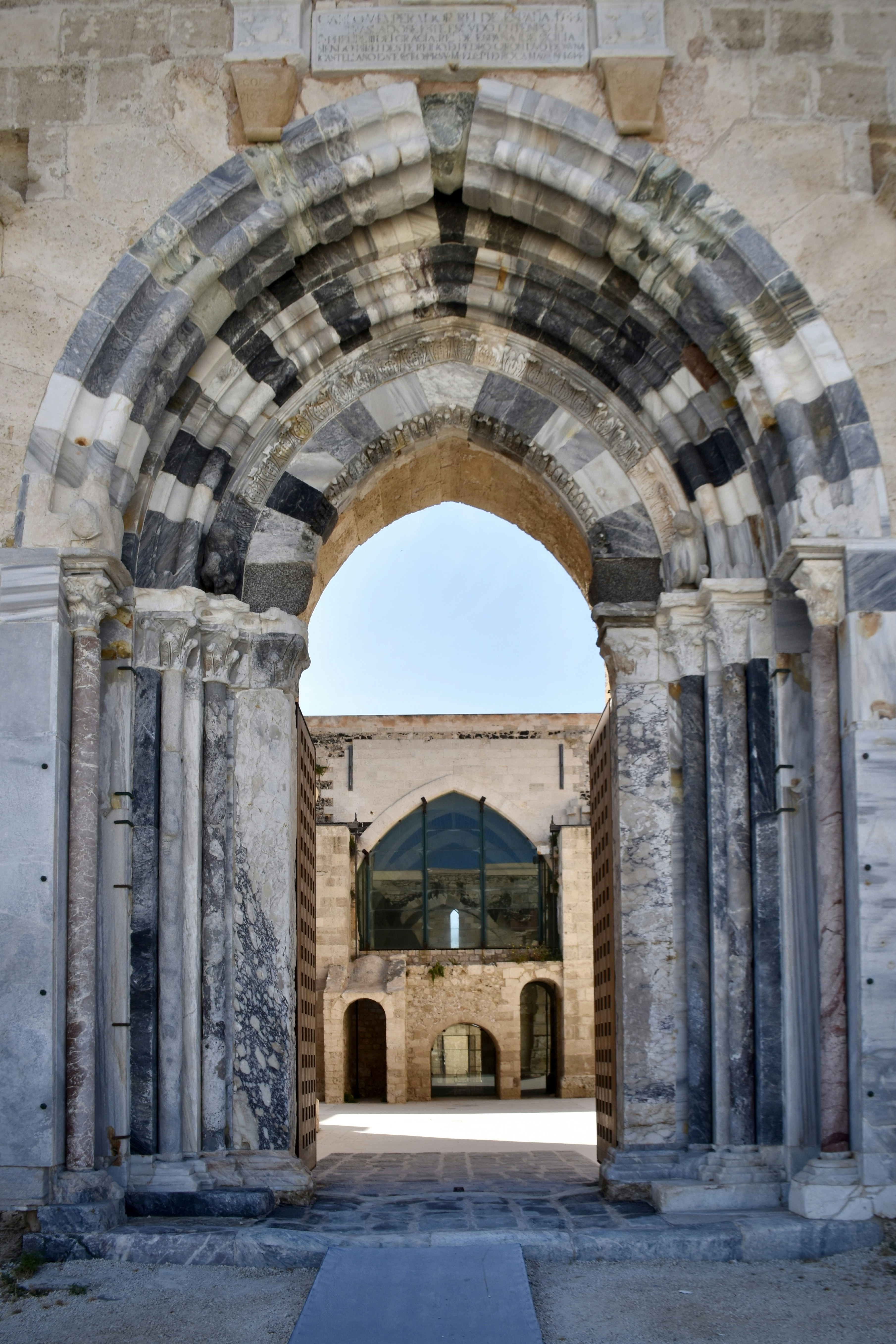 Silvery Archway Through Time: Marble Concourse Framing a Courtyard