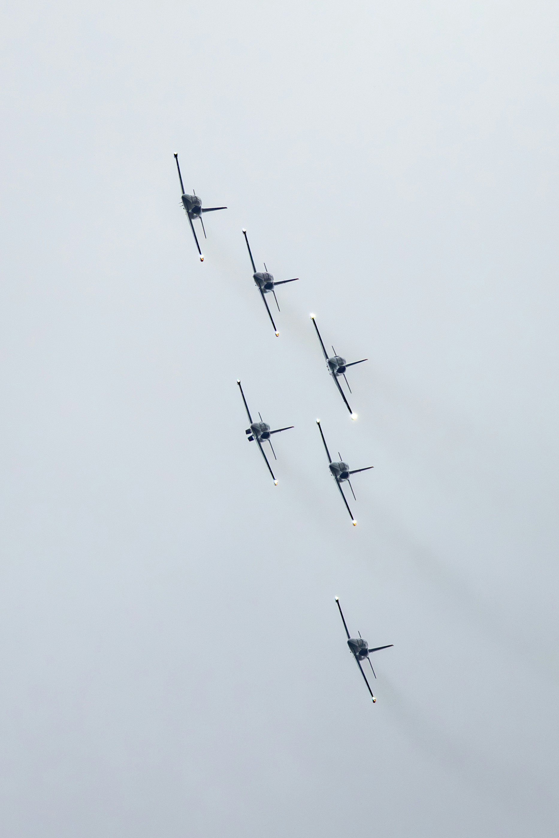 Six-Plane Aerial Drift: A Formation Against a Pale Sky