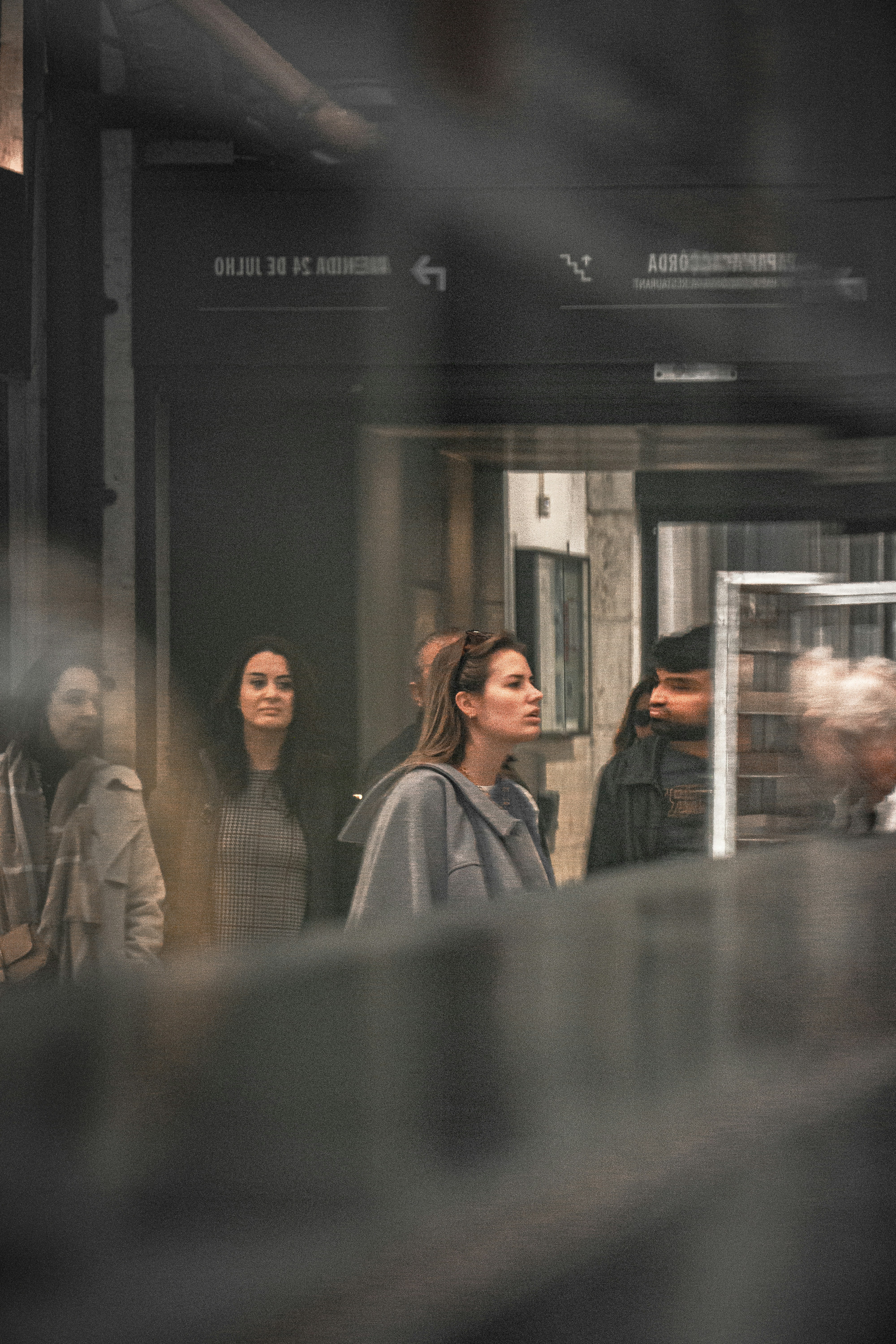 Faces in the Glass Corridor