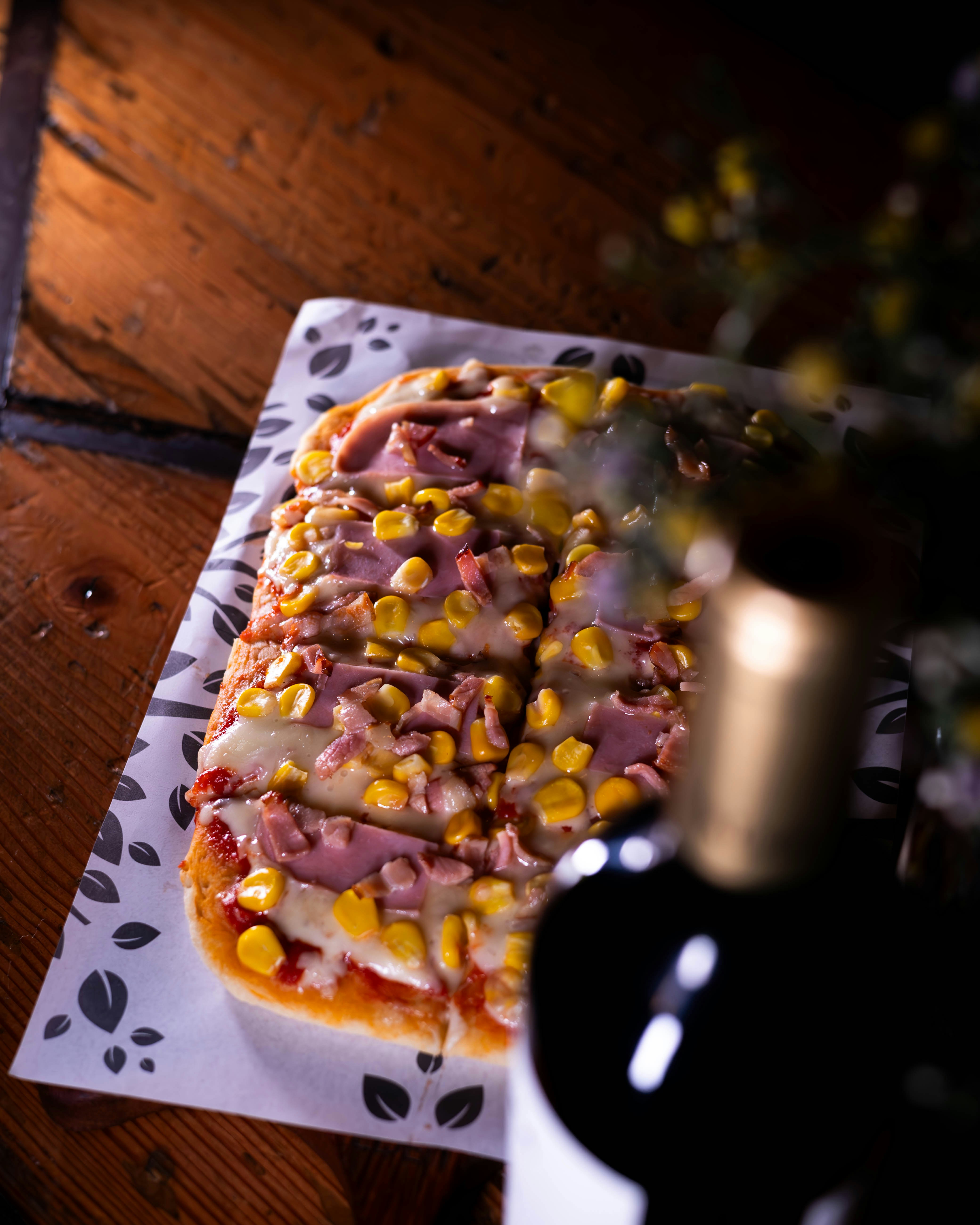 Melted Ham and Corn Slice on a Rustic Wood Table