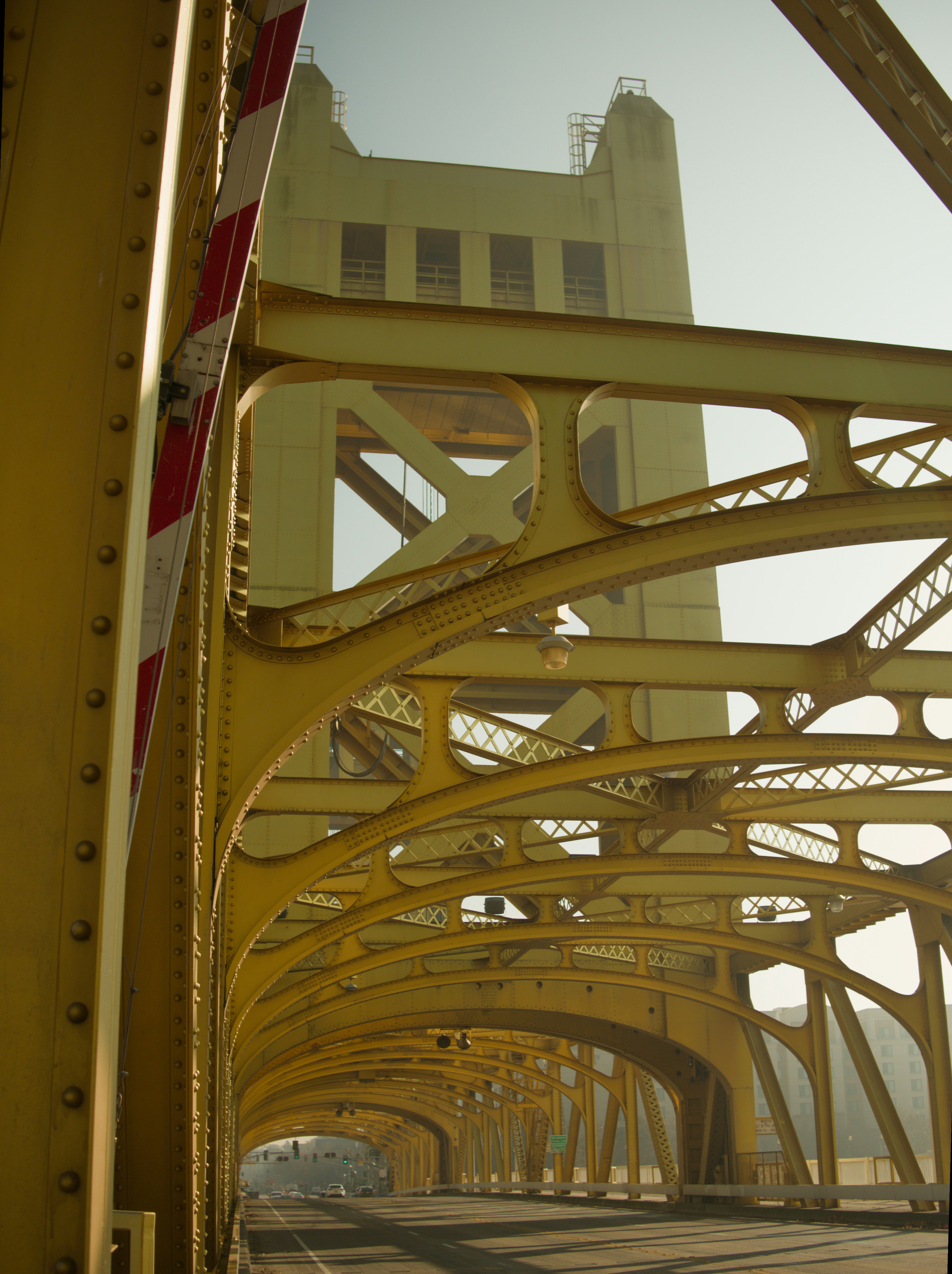Golden Railway Arc: Light and Metal Through the Bridge