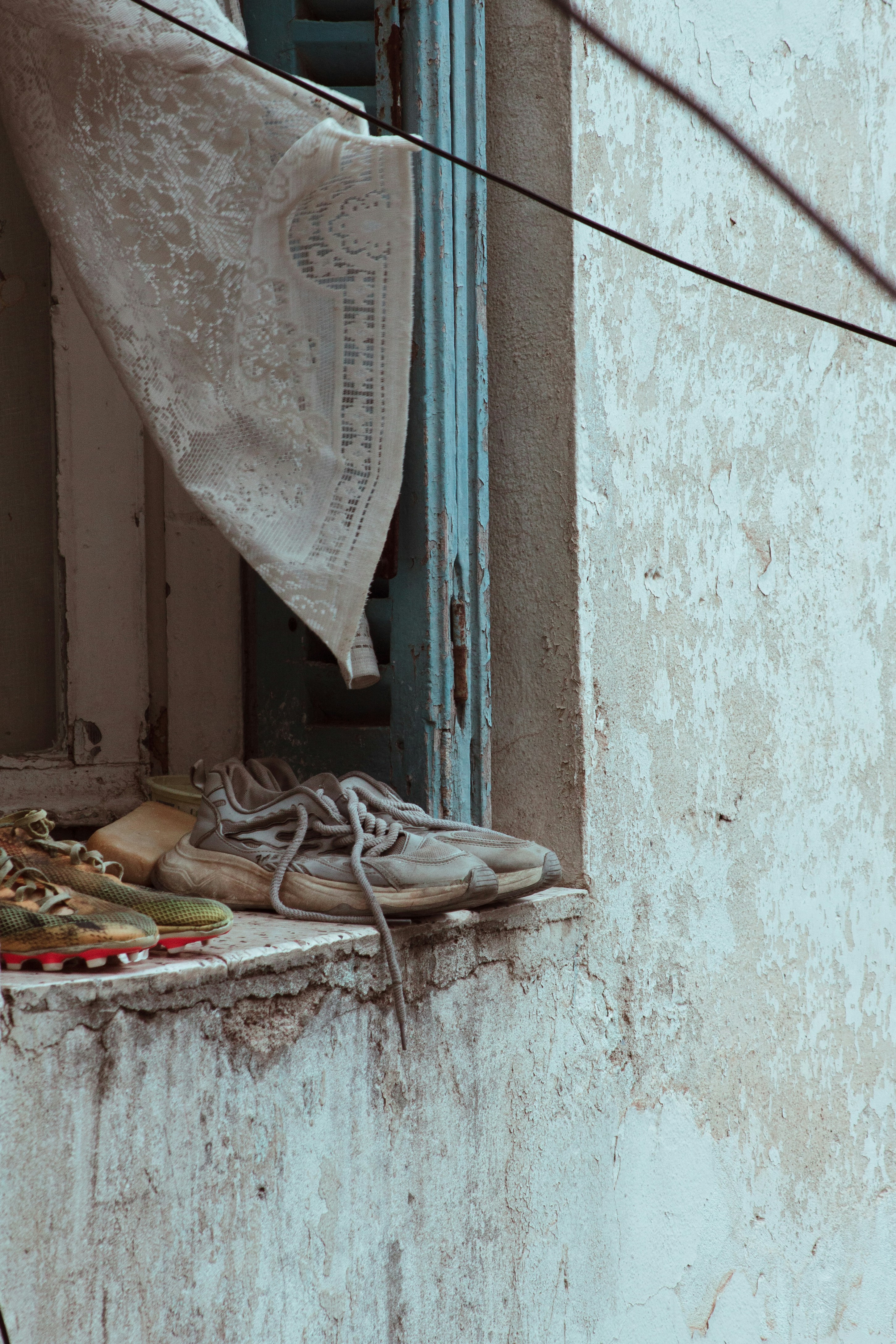 Shoes on a Weathered Threshold