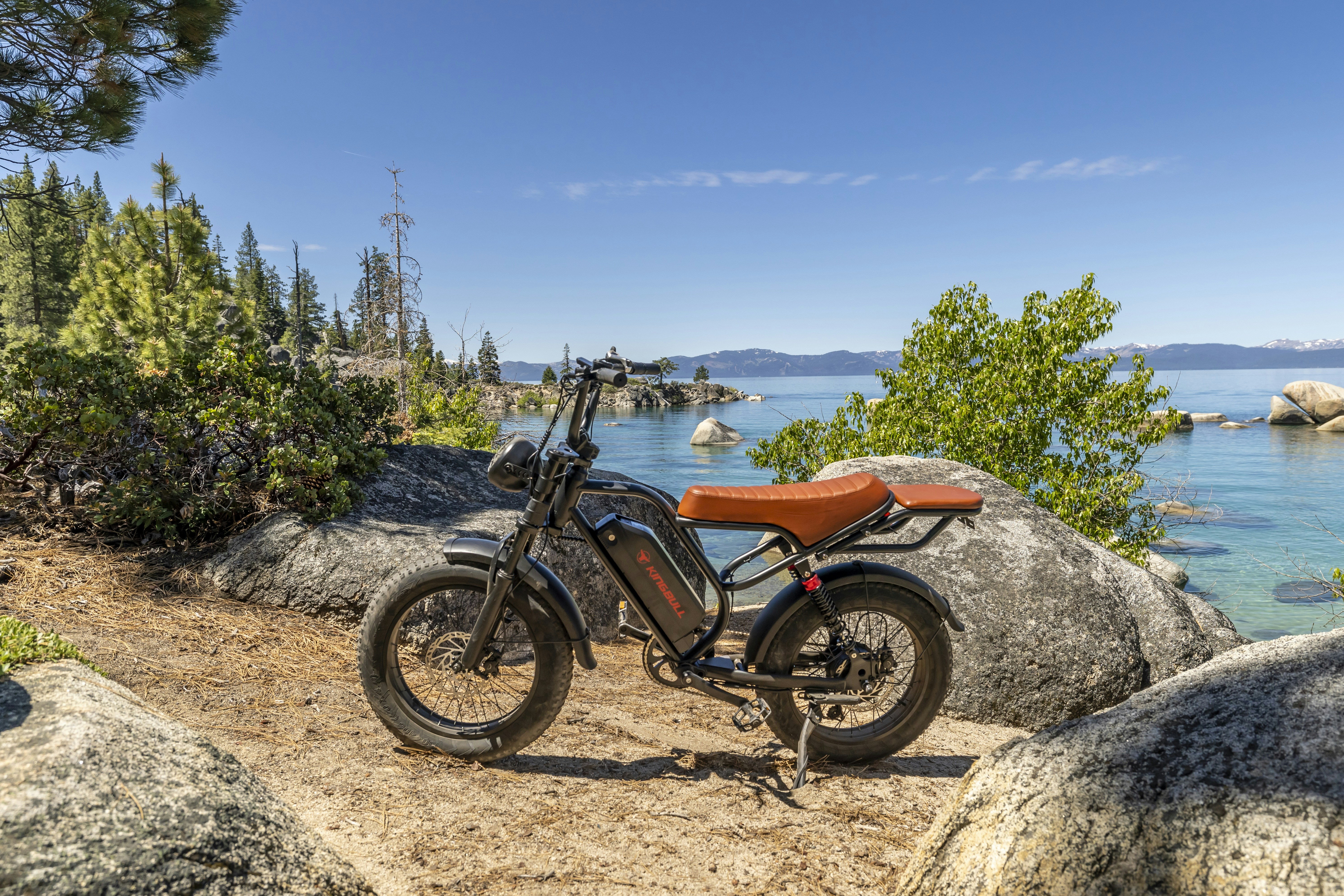 Electric bike on a trail overlooking a beautiful blue lake.