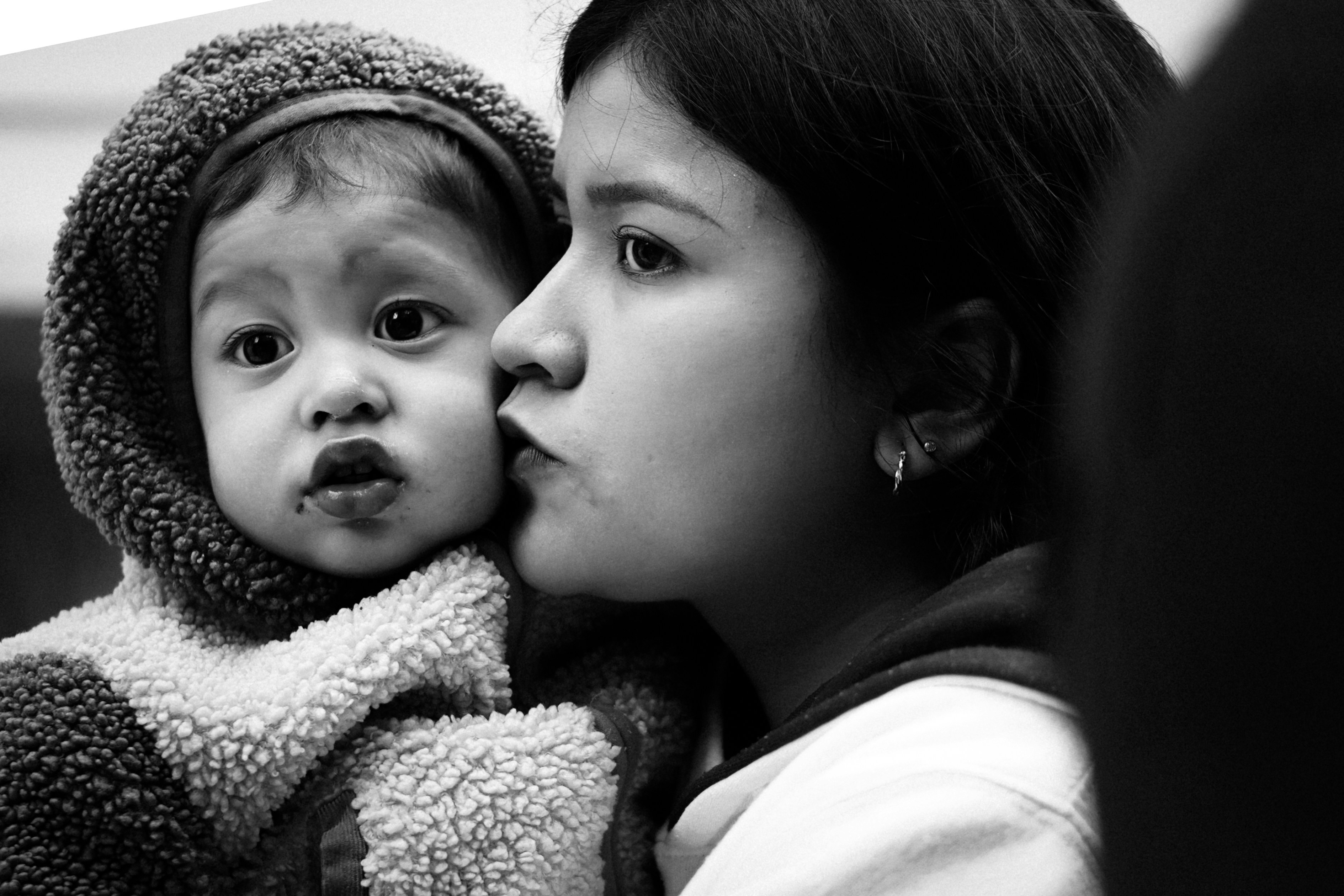 Mother's kiss: quiet moment between caregiver and child