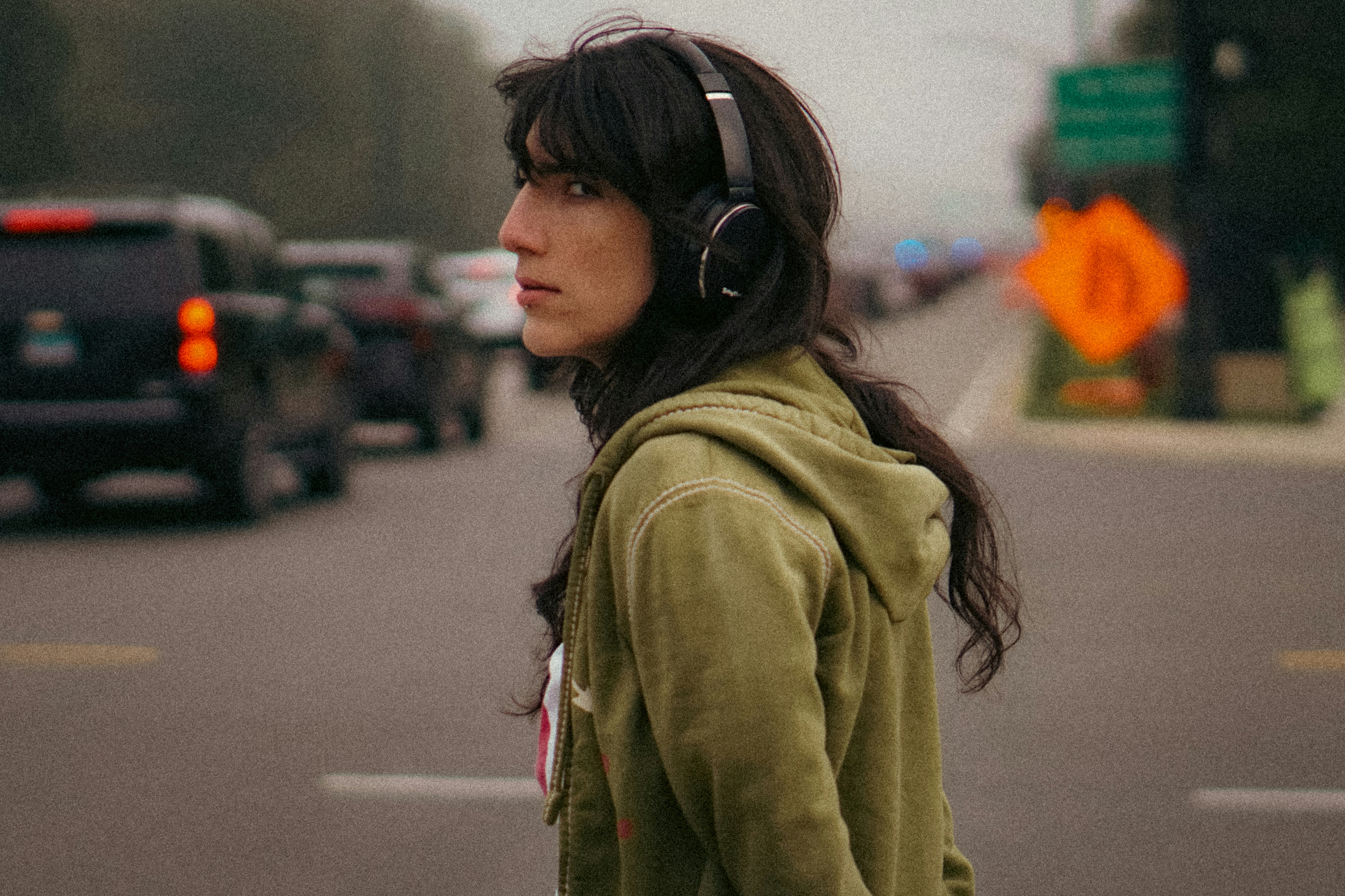 Street Quiet: A Runner in Headphones on a Blurred Morning Road