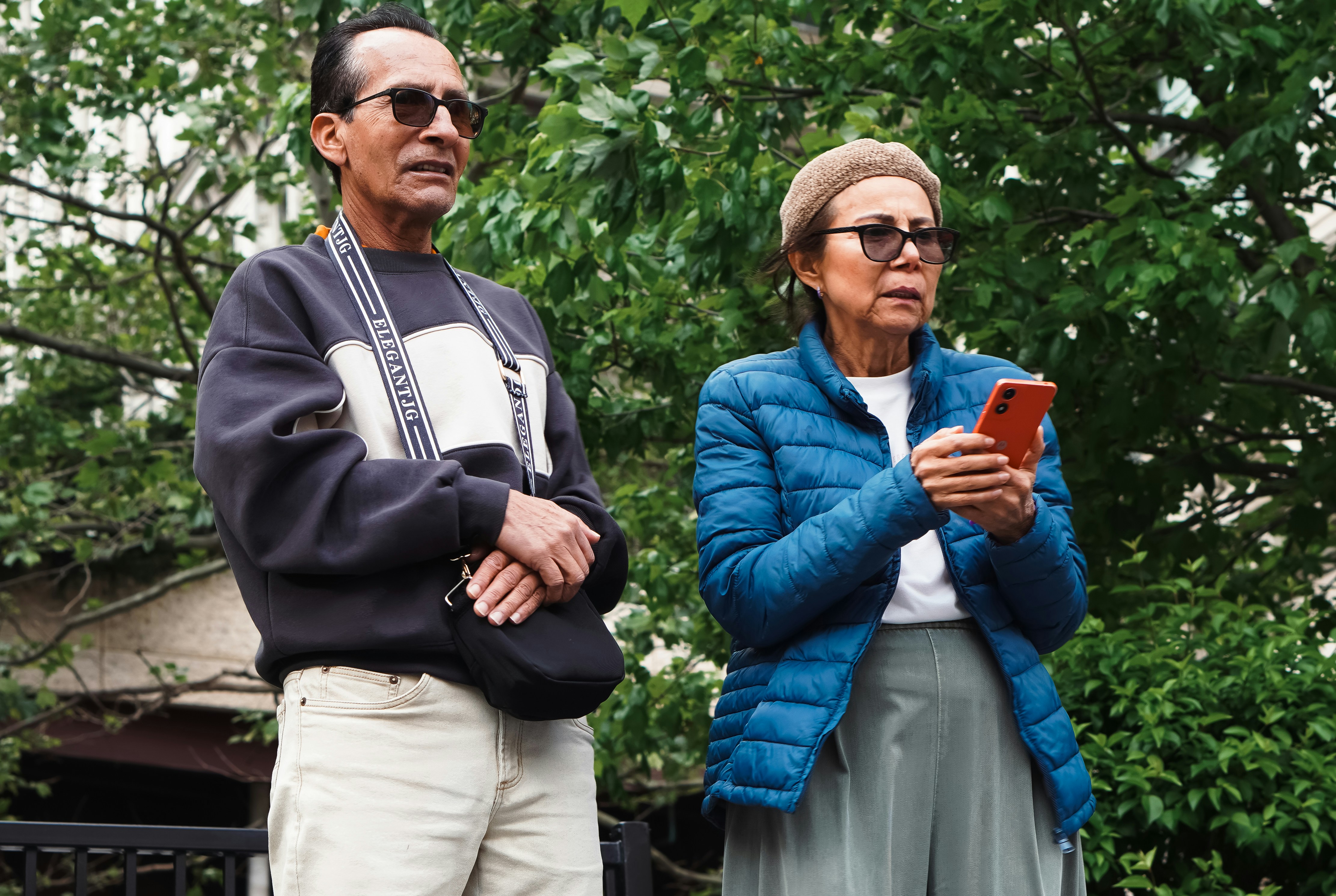Two Seniors in Quiet Vigil: A Moment of Presence in a Lush Garden