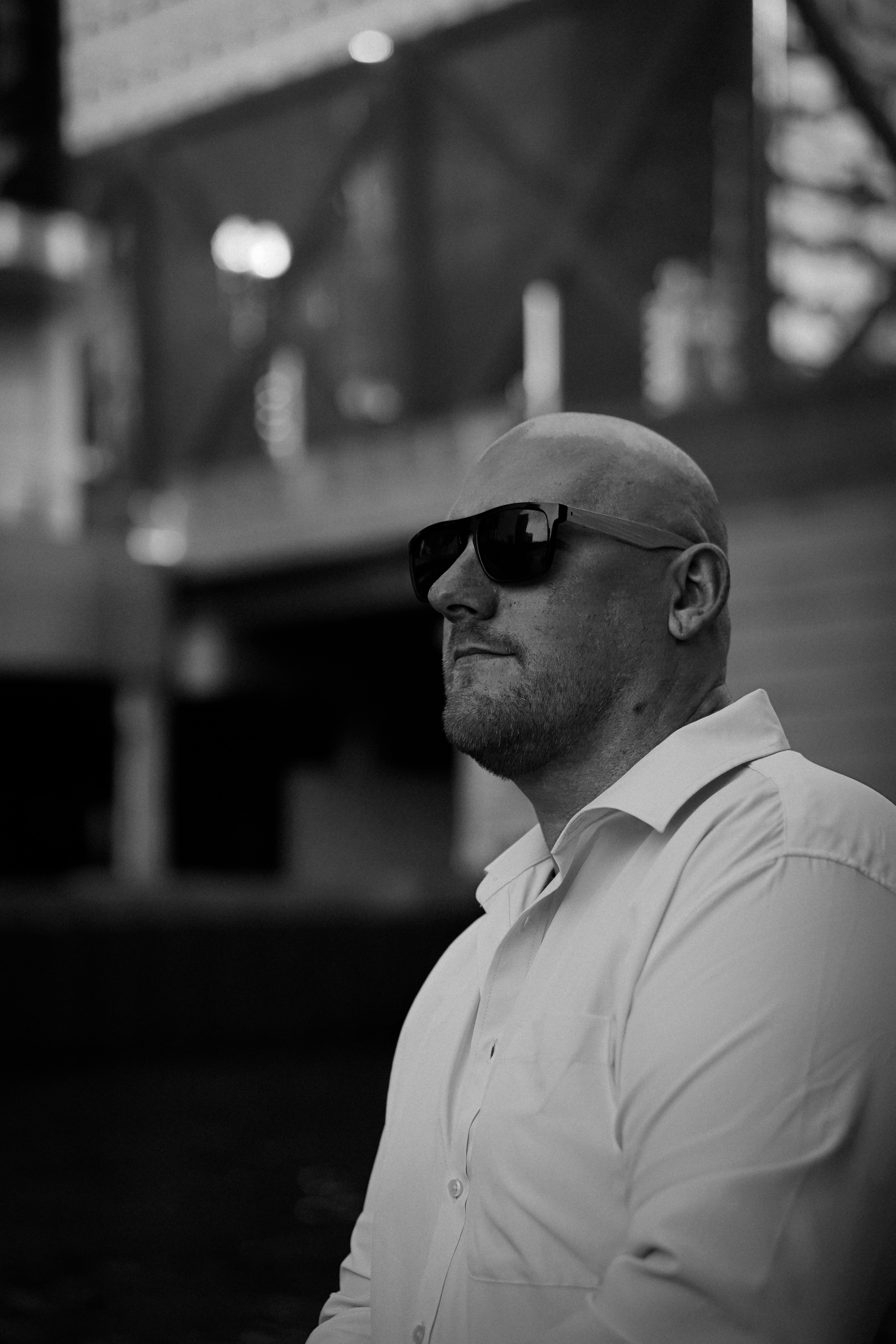 Sunglassed Confidence: Portrait in Soft Focus Urban Night