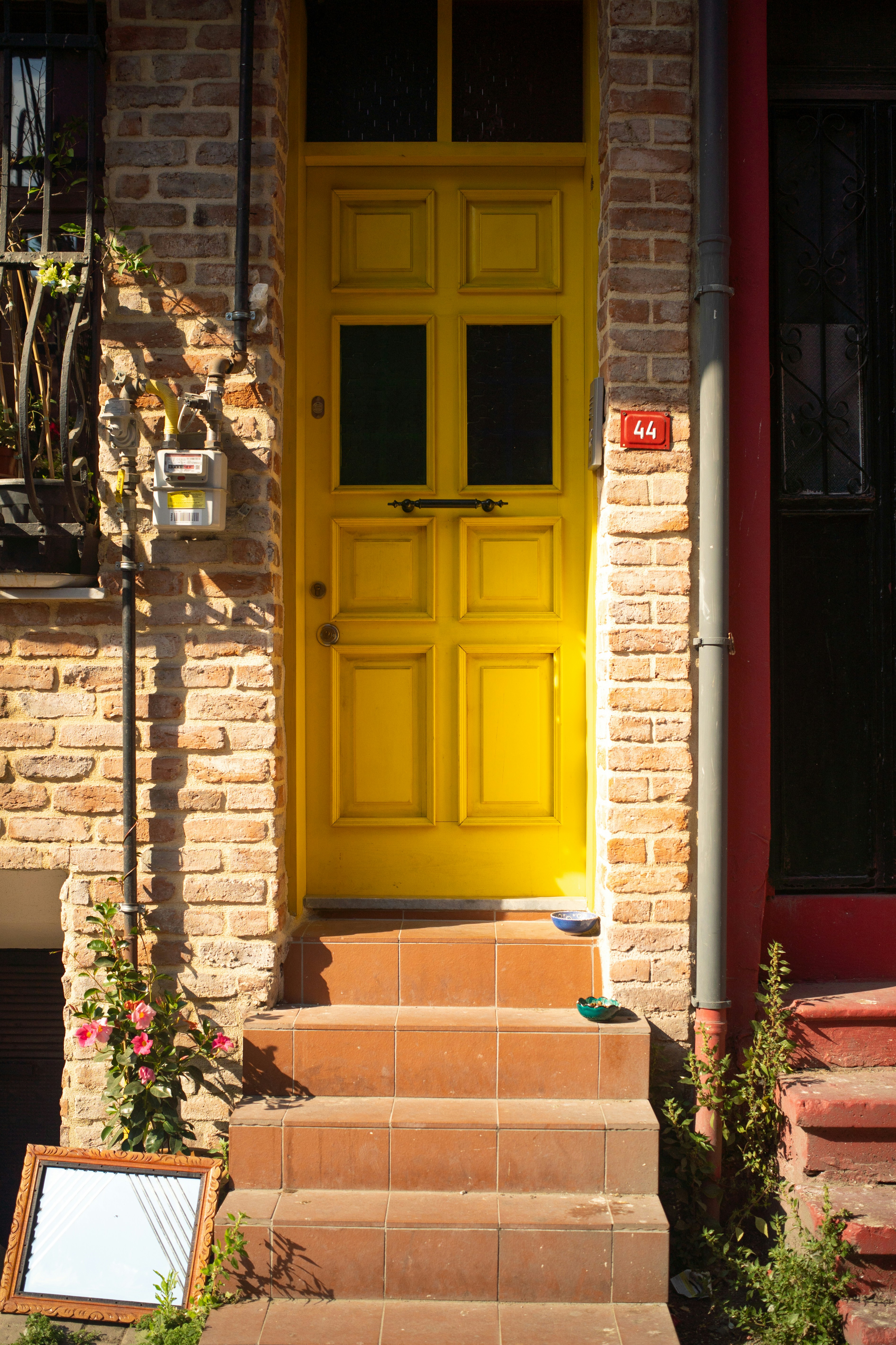 Bold Yellow Door in Brick Facade