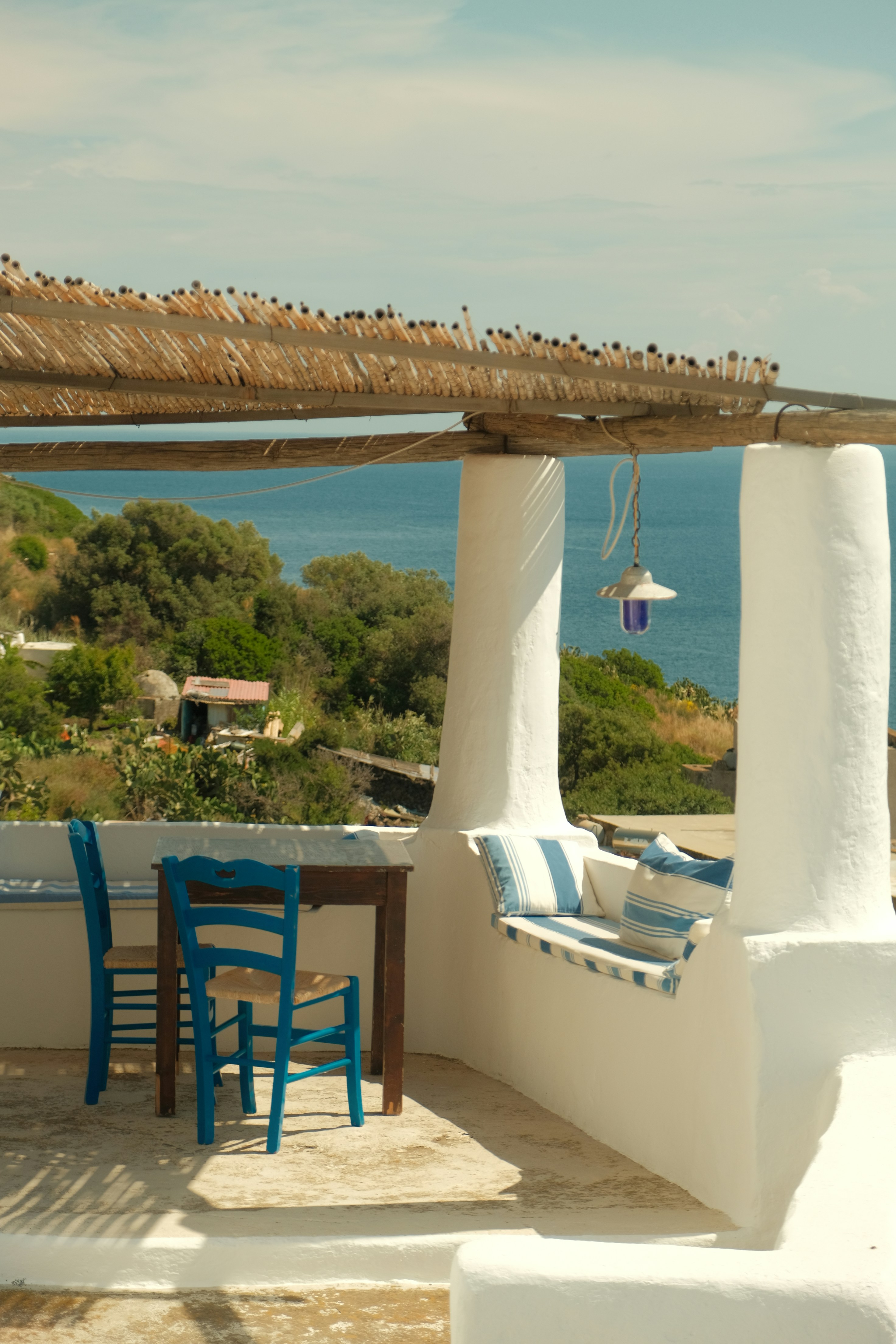 White Terrace Overlooking the Sea: A Tranquil Balcony Scene