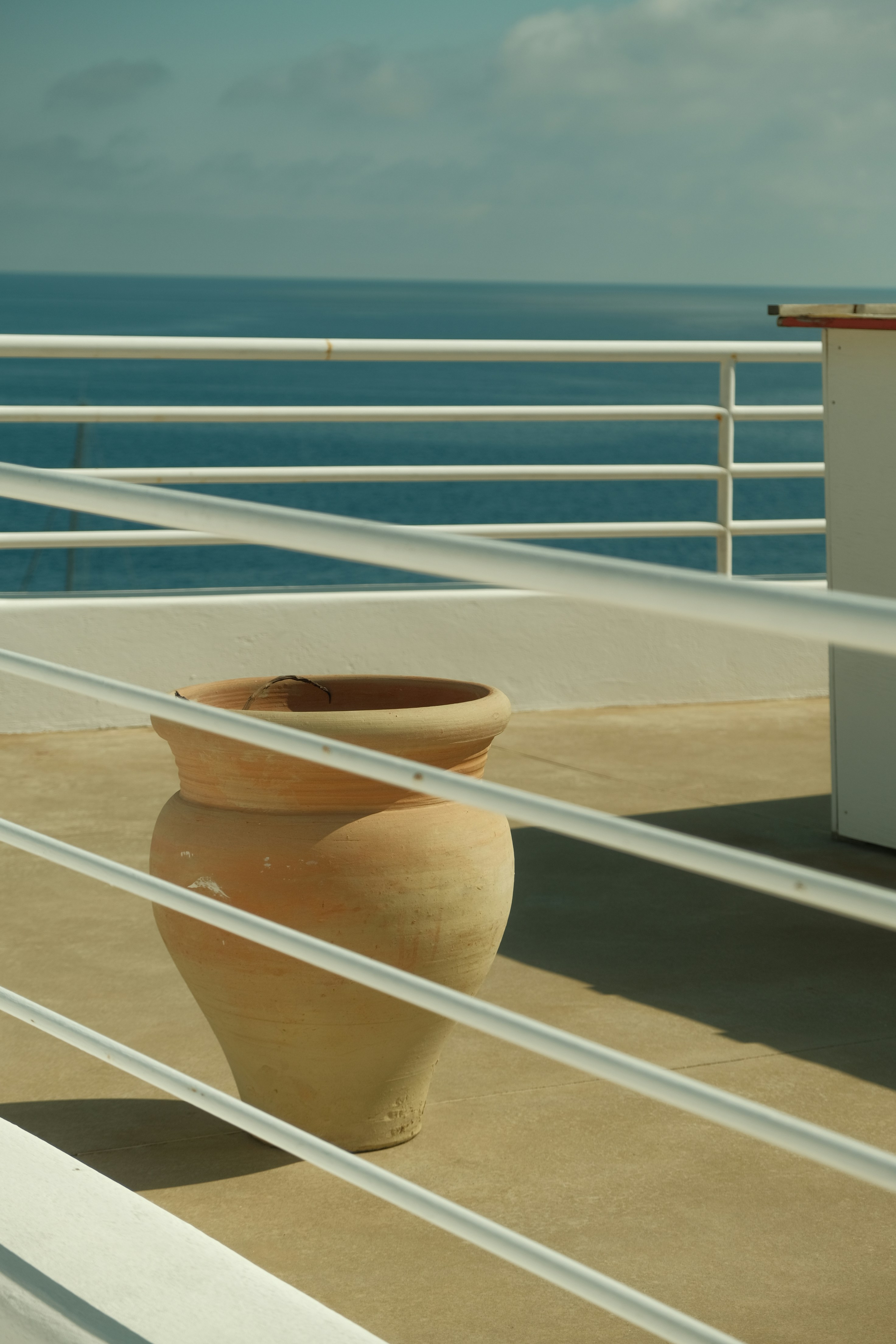 Ocean Terrace with Sculpted Pot and Quiet Horizon