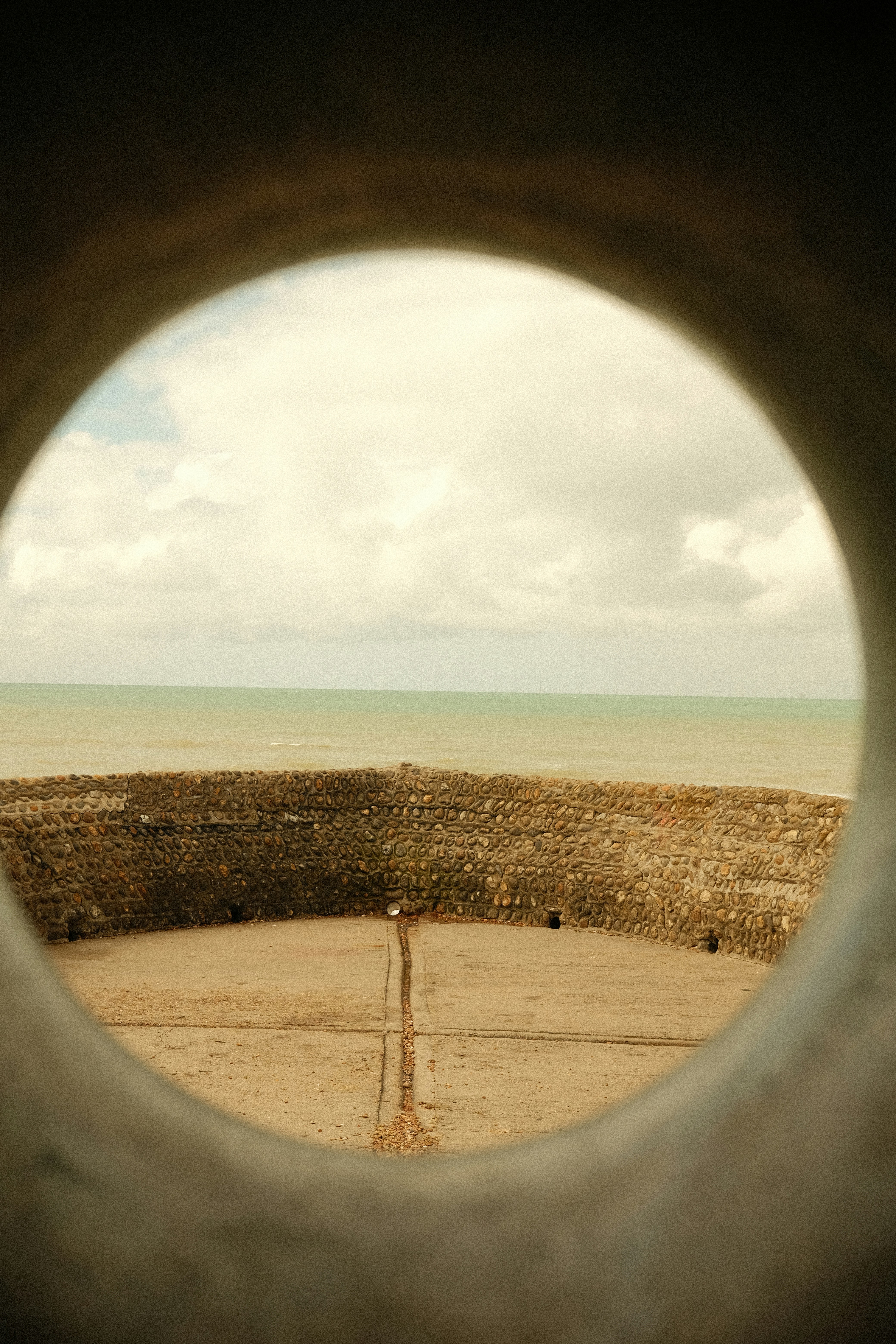 Circular View: Sea Wall Framed by Concrete Ring
