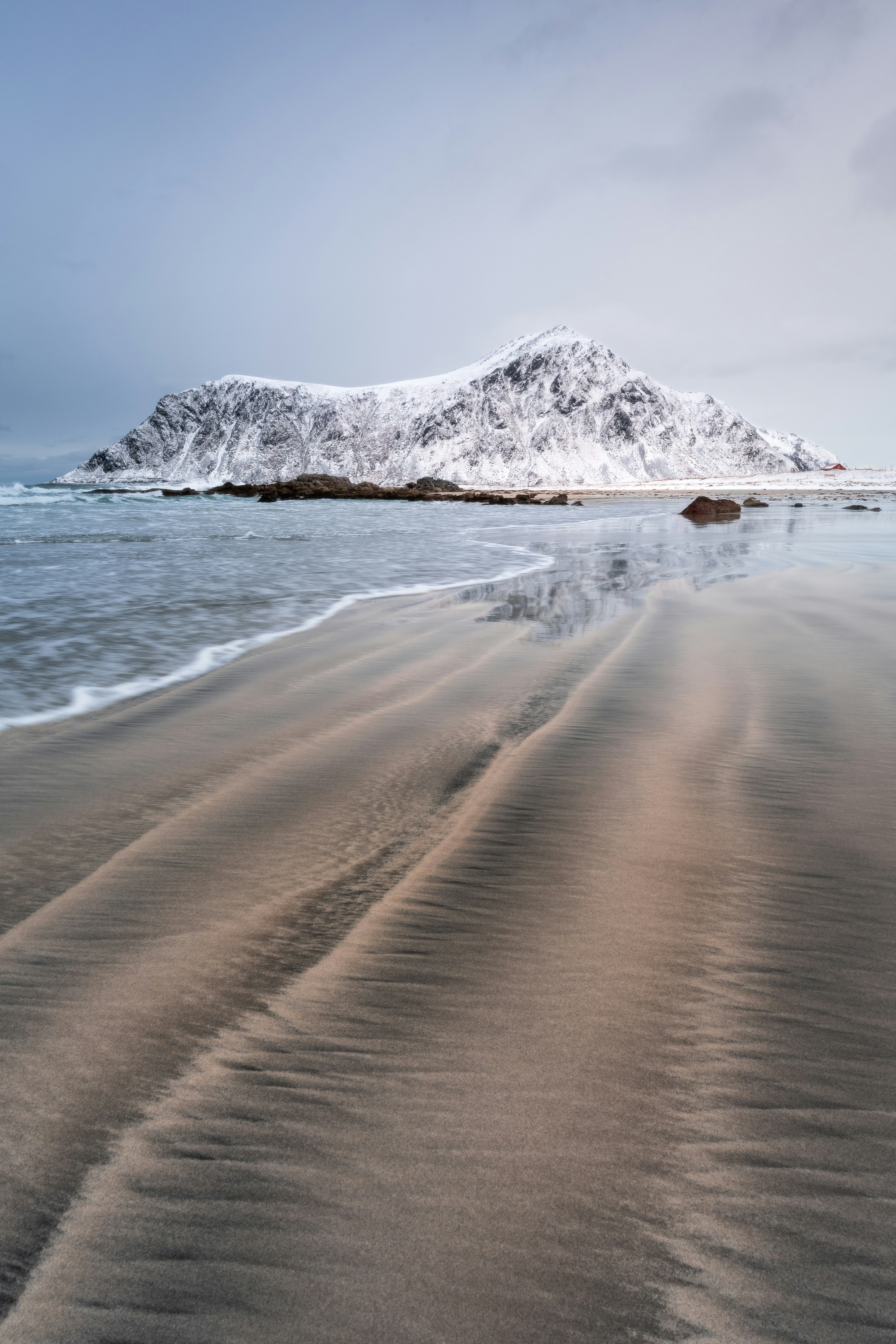 Snow-formed Island Crowned by Sea and Sky