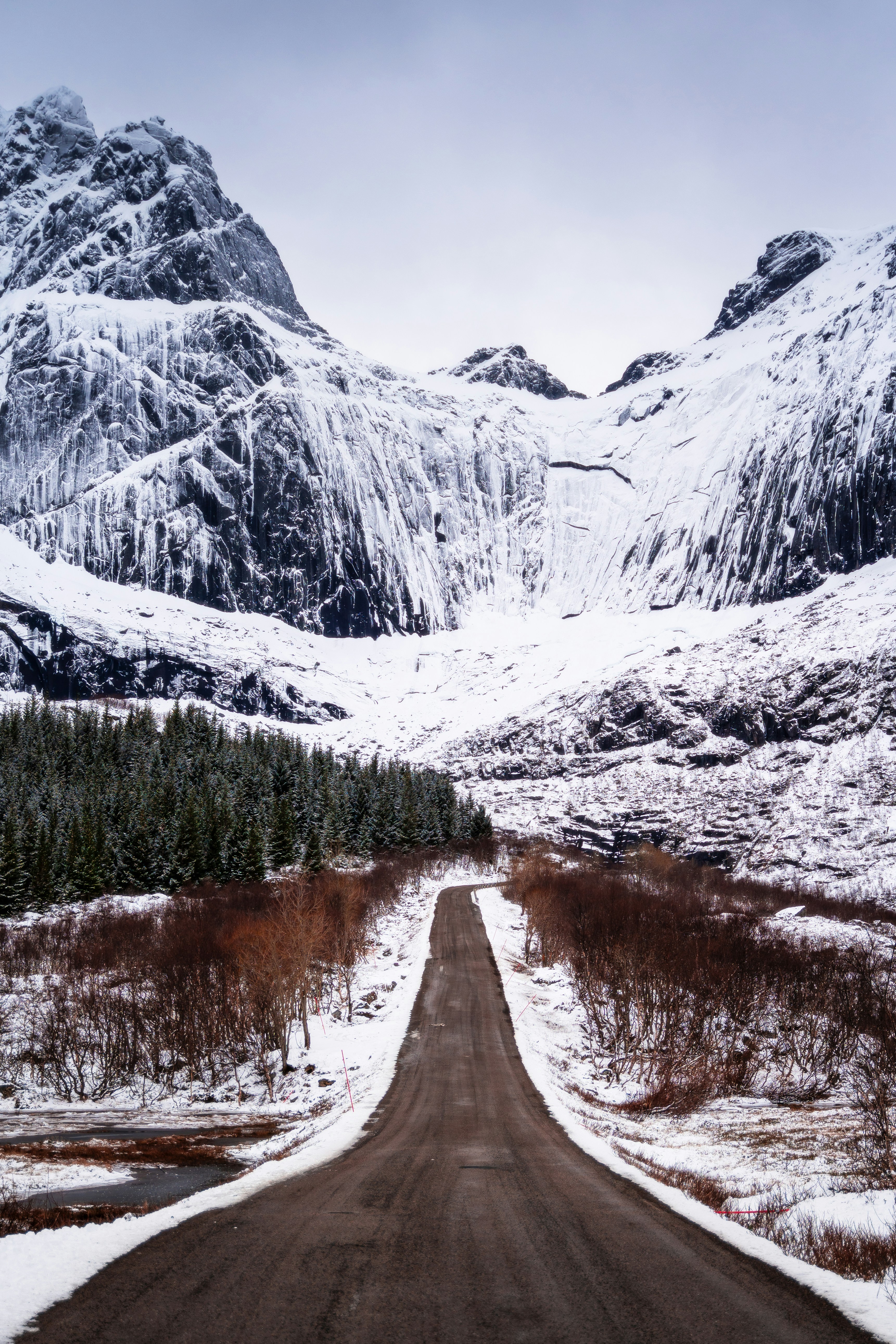 Snow-Wrapped Pass Carved by a Lone Road