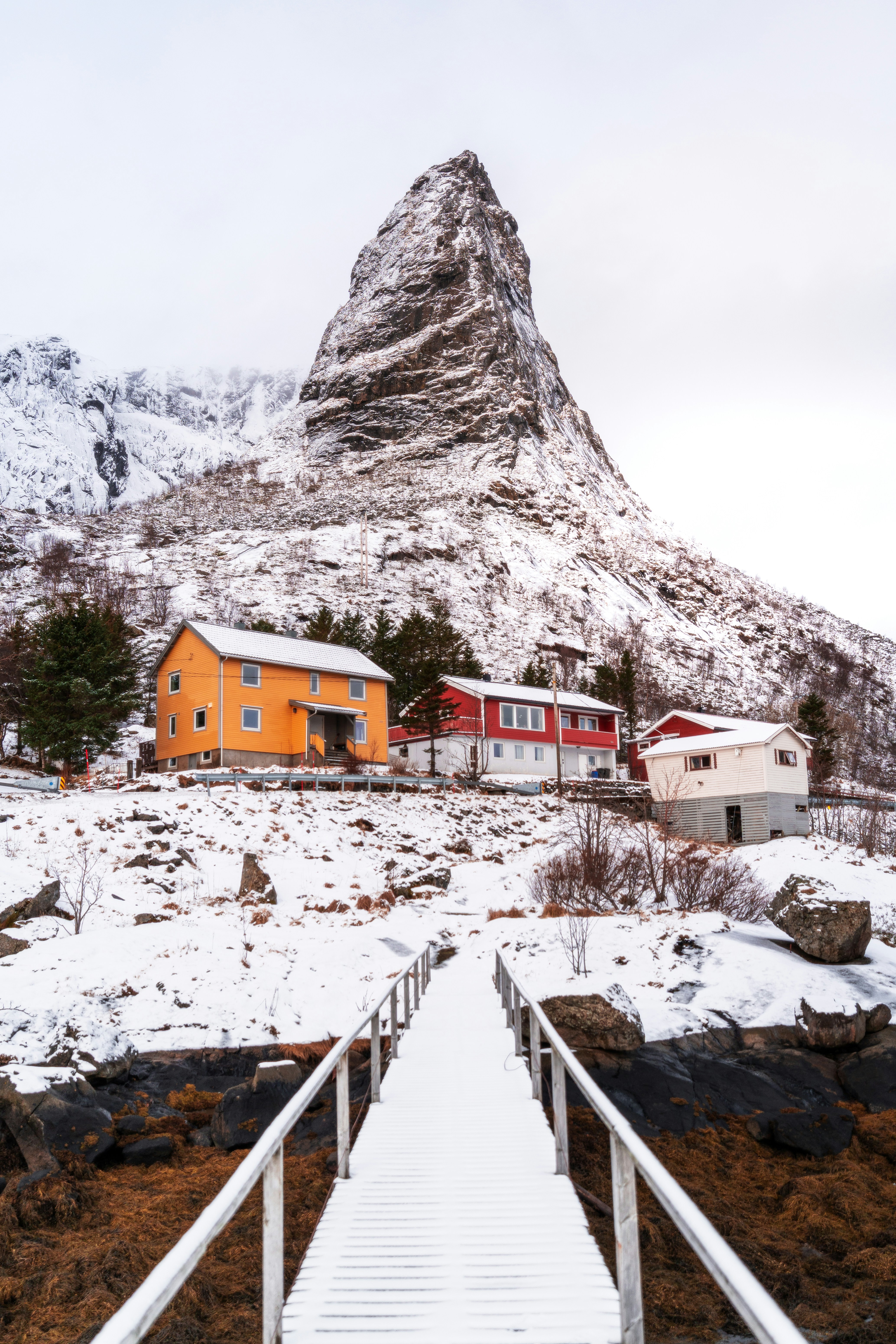 Snowbound Peaks and Colorful Cottages Under a Lofty Spire