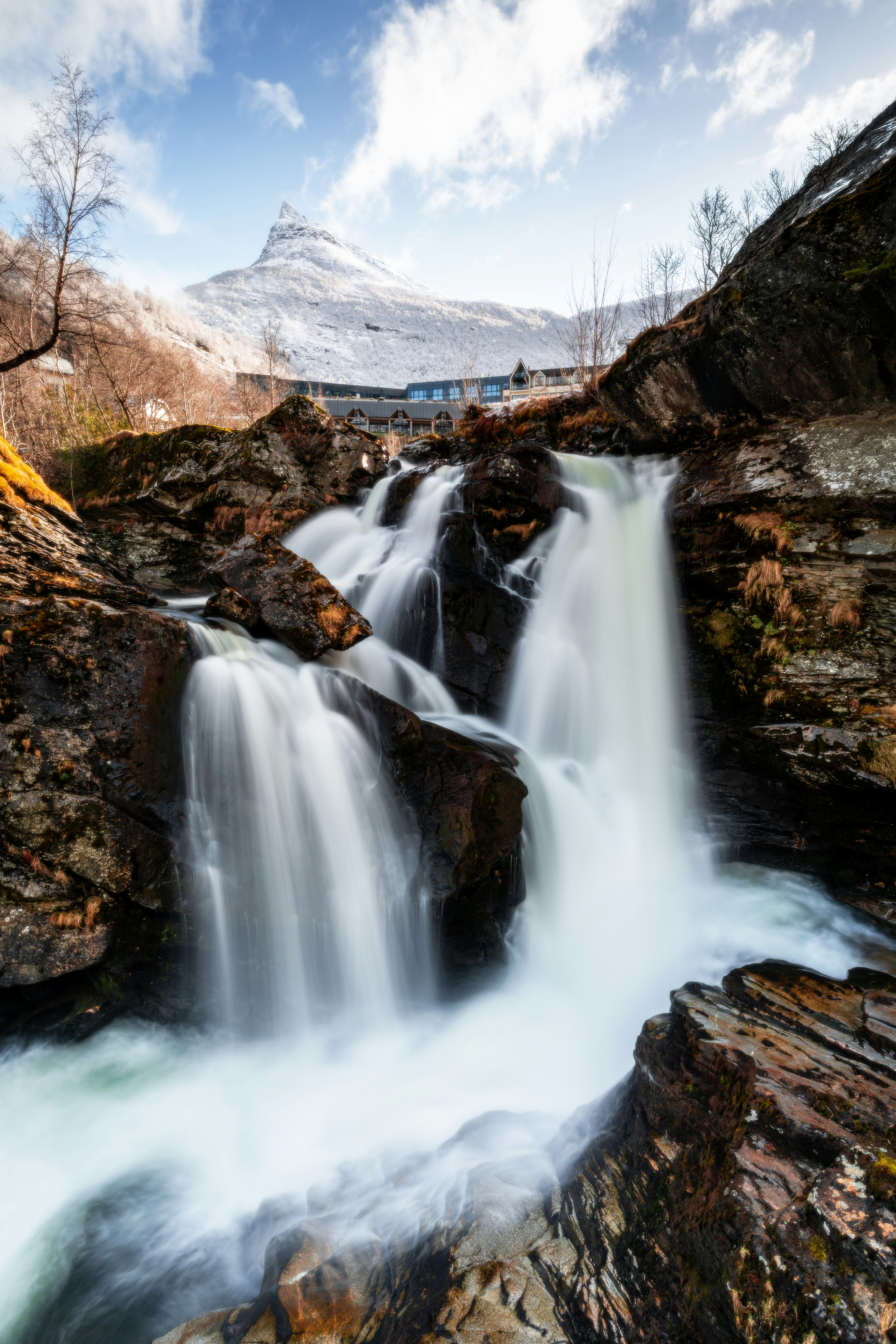 Winter Cascade Under a Snow-Trimmed Peak