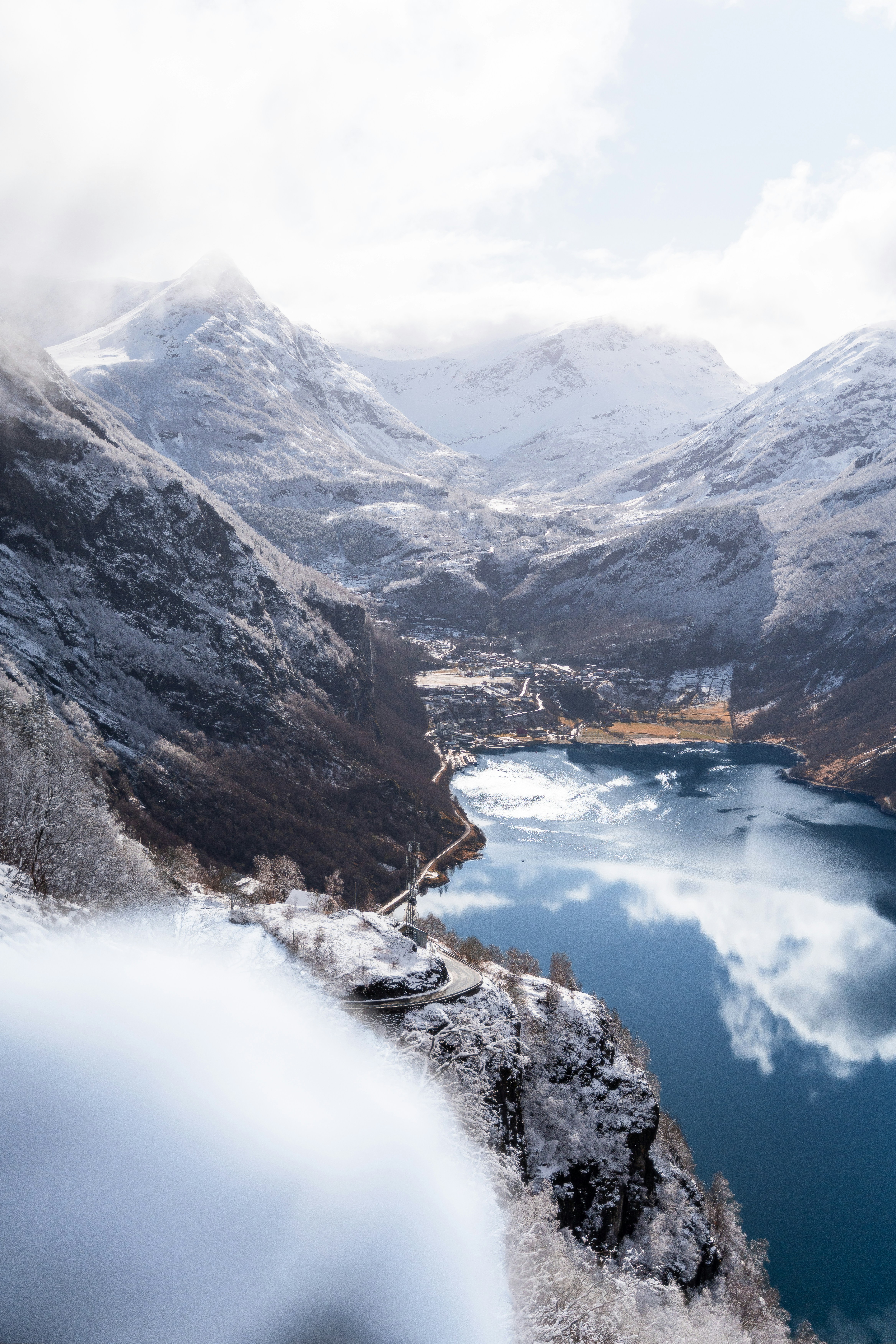 Snowbound Fjord: A Mirror of Mountain and Lake