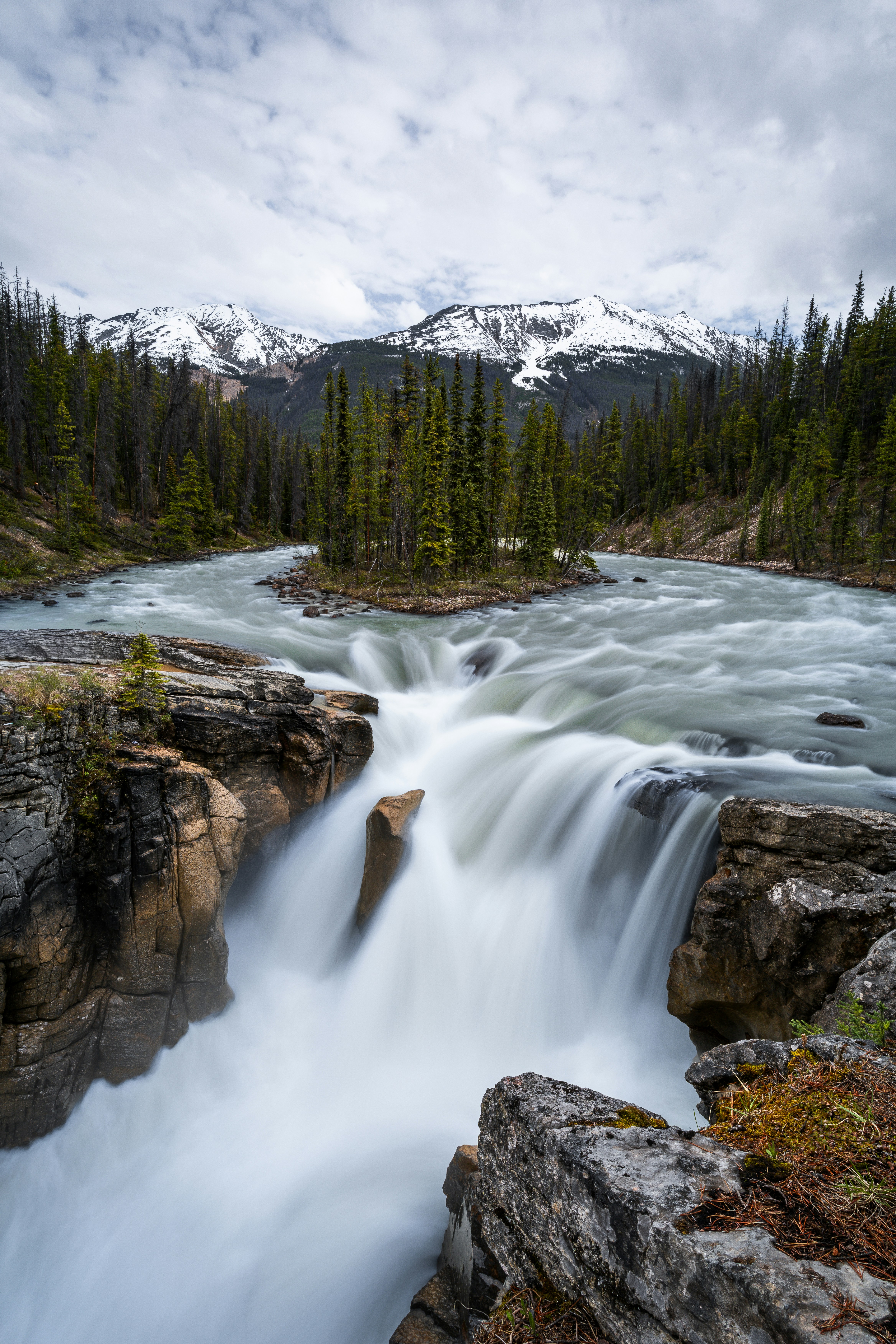Snowy Peaks Over Turbulent Gorge